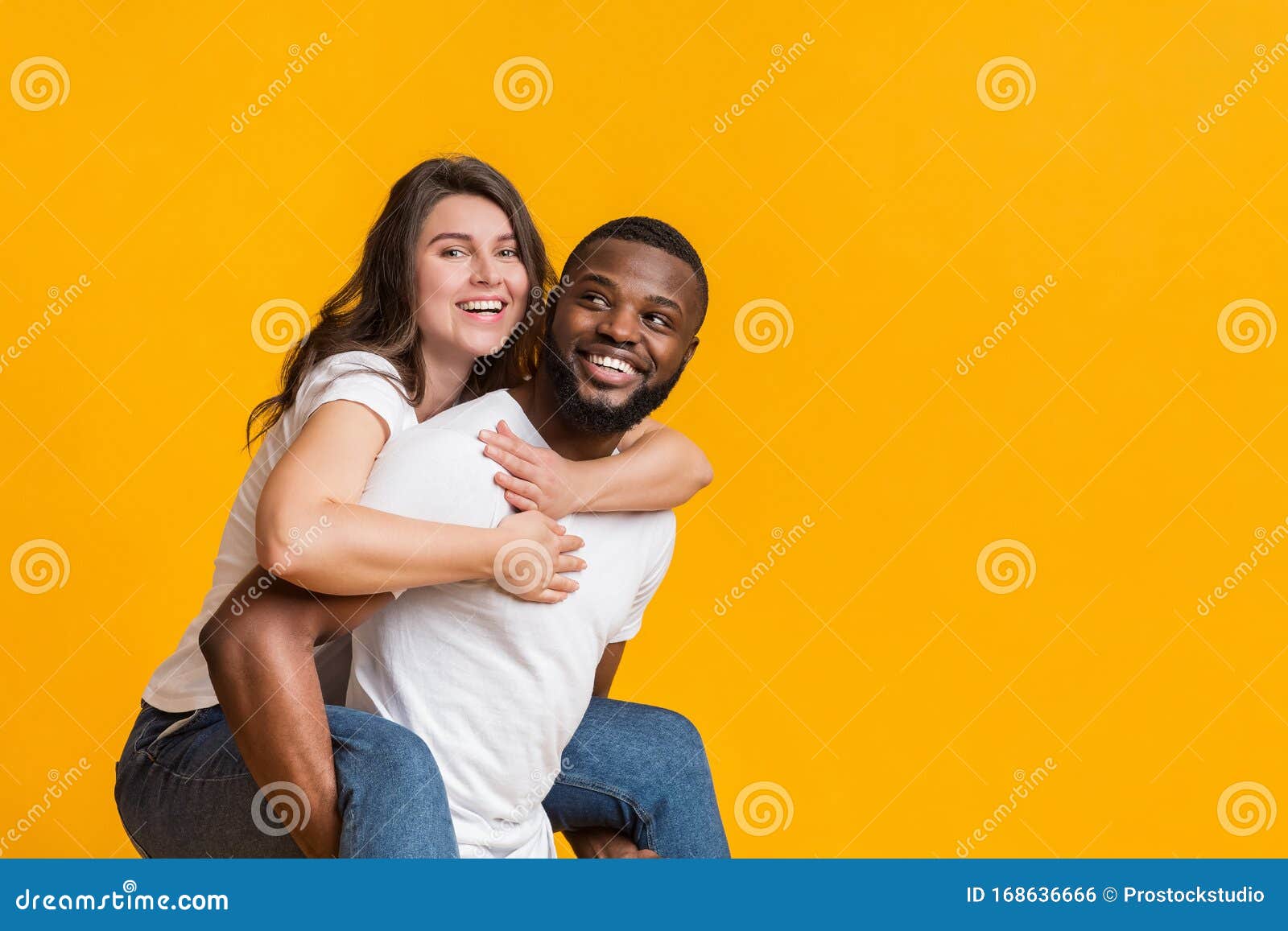 Cheerful Black Guy Piggibacking His Girlfriend, Interracial Couple ... Cheerful Black Guy Piggibacking His Girlfriend, Interracial Couple ...