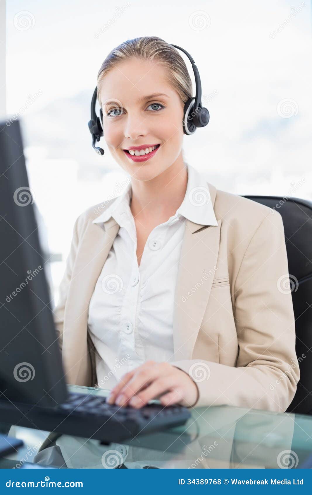 Cheerful Blonde Call Centre Agent Working on Computer Stock Photo ...