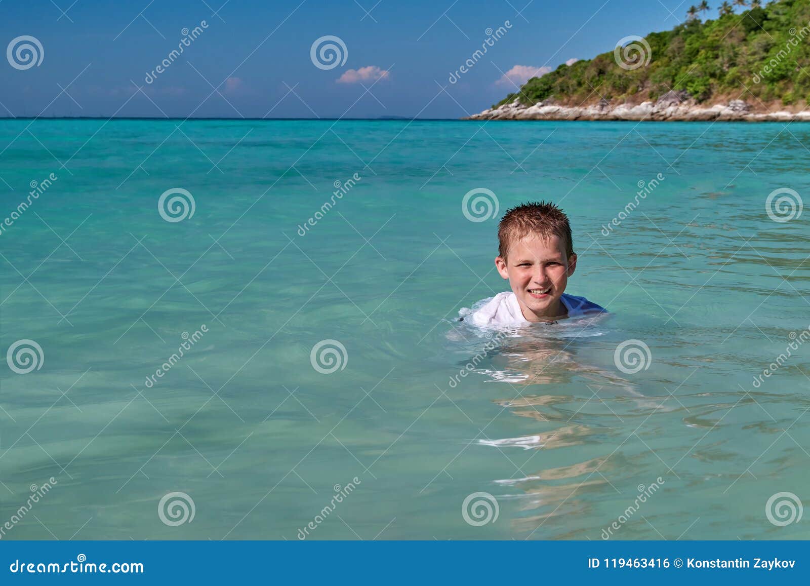 Cheerful Boy Bathes in the Tropical Sea, Sunny Day. Cute Child Swimming ... Cheerful Boy Bathes in the Tropical Sea, Sunny Day. Cute Child Swimming ...