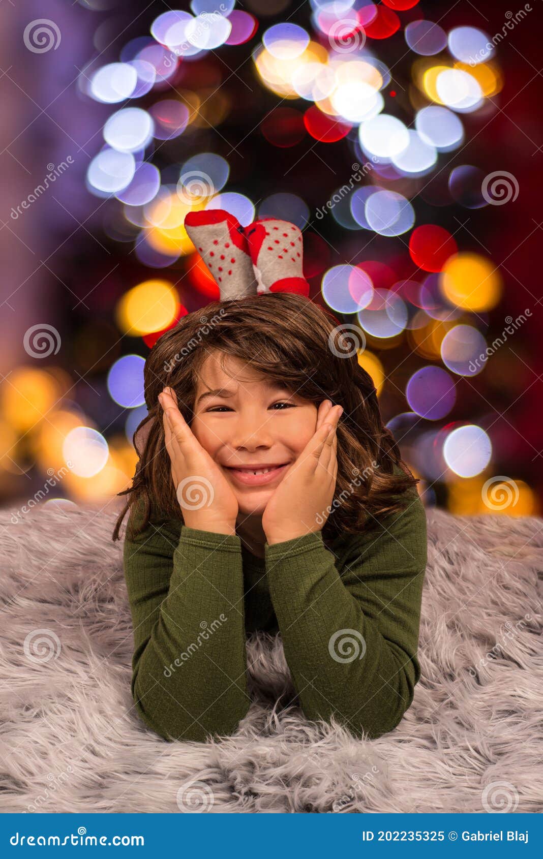 Cheerful Boy Laying in Front of Lights Stock Image - Image of fluffy ...