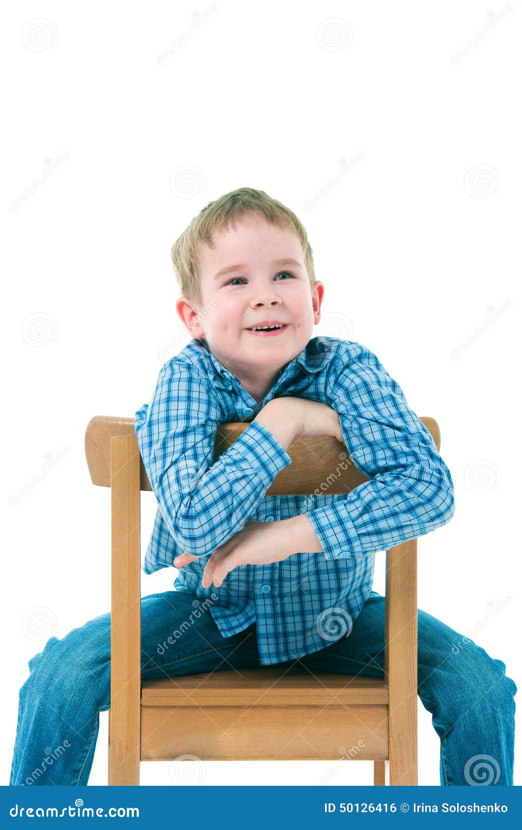 Cheerful Boy Sitting on a Chair Stock Photo - Image of dark, high: 50126416