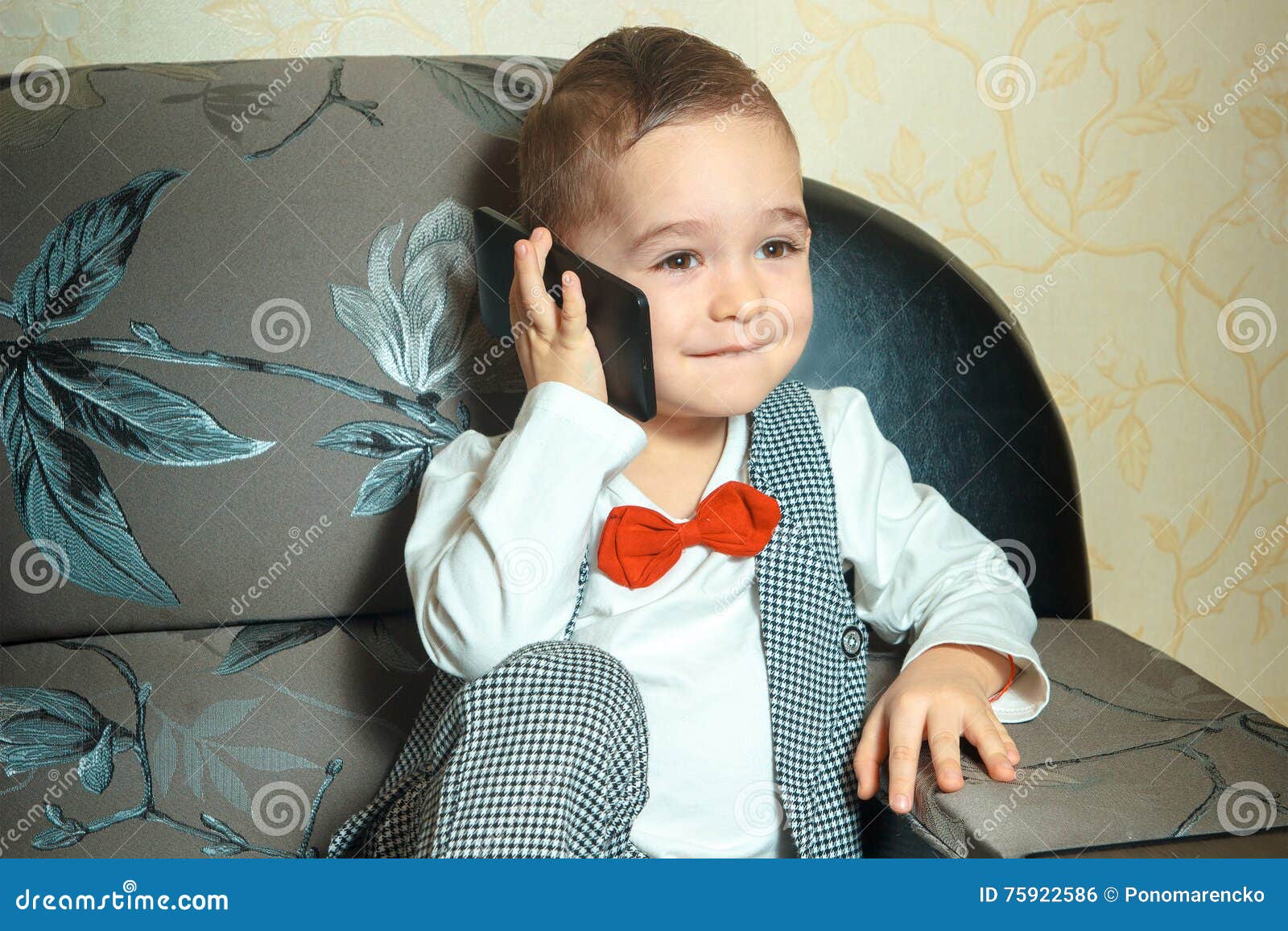 Cheerful boy talking phone stock photo. Image of cellphone - 75922586