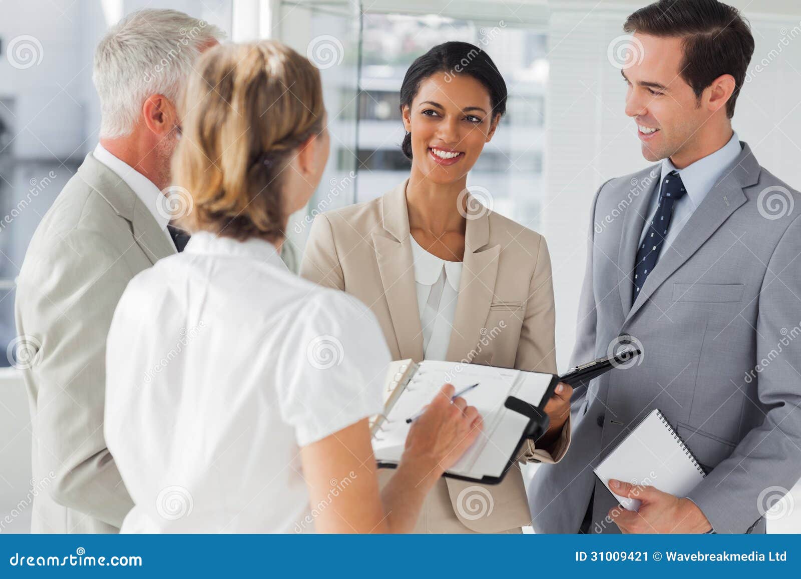 Cheerful Business People Making an Appointment Stock Image - Image of ...