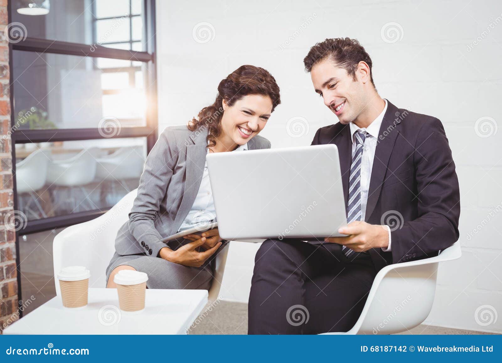 Cheerful Business People Using Technology Stock Photo - Image of drink ...
