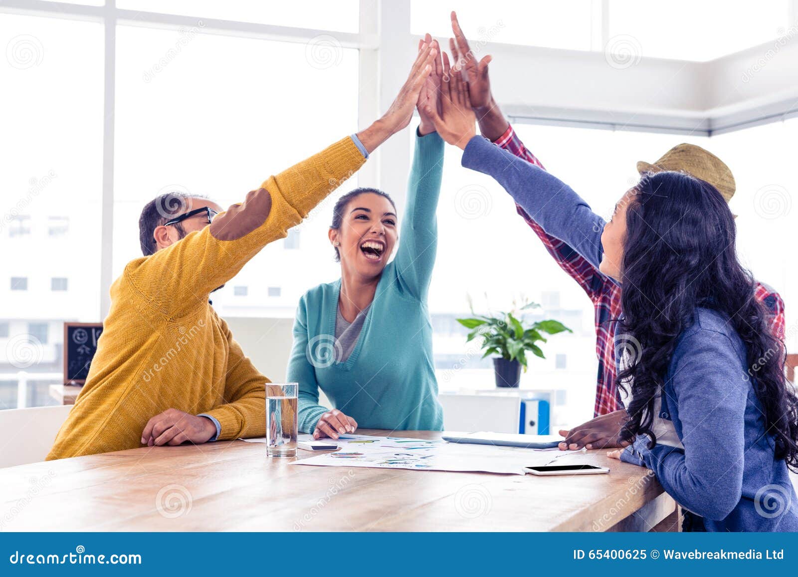 Cheerful Business Team Doing High Five in Creative Office Stock Image ...