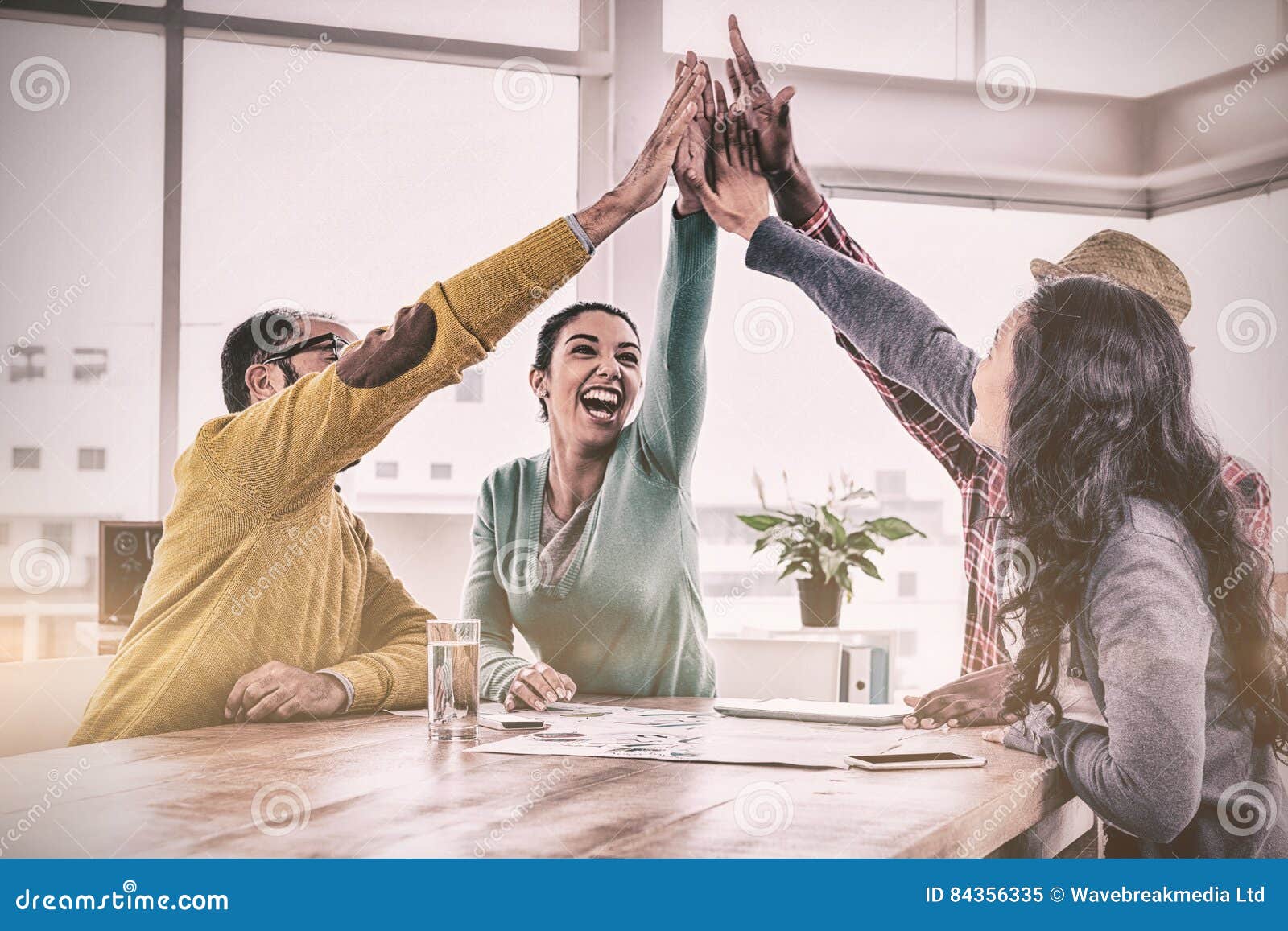 Cheerful Business Team Doing High Five in Creative Office Stock Image ...