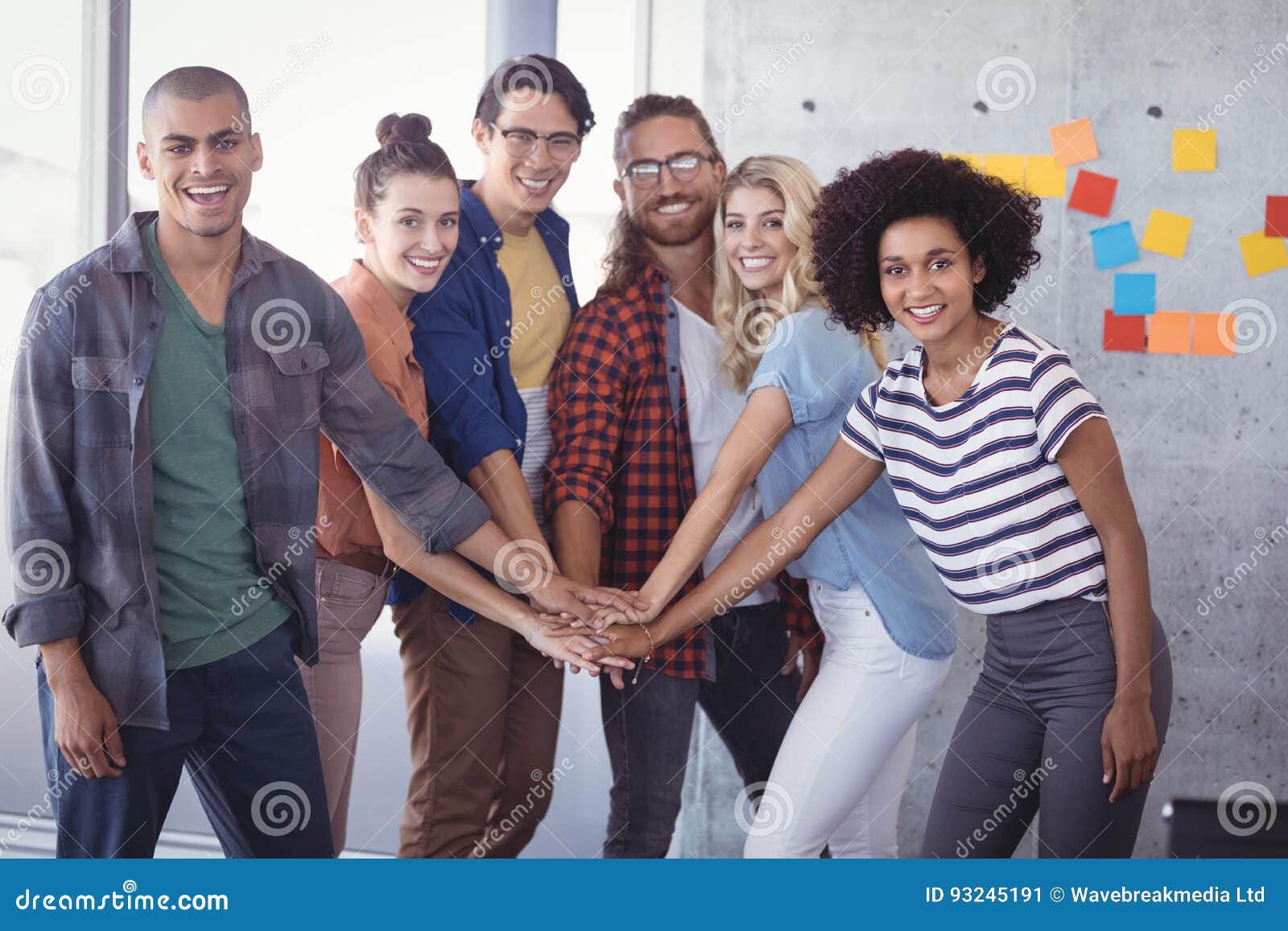 Cheerful Business Team Stacking Hands in Creative Office Stock Image ...