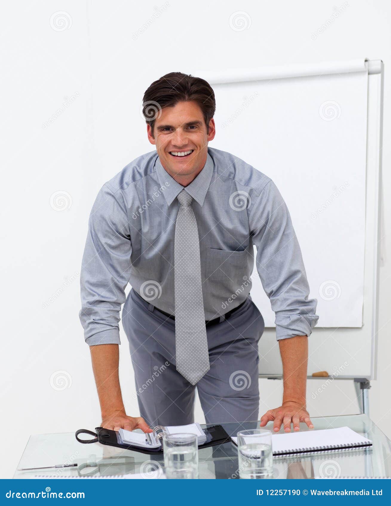 Cheerful Businessman Leaning on a Conference Table Stock Photo - Image ...