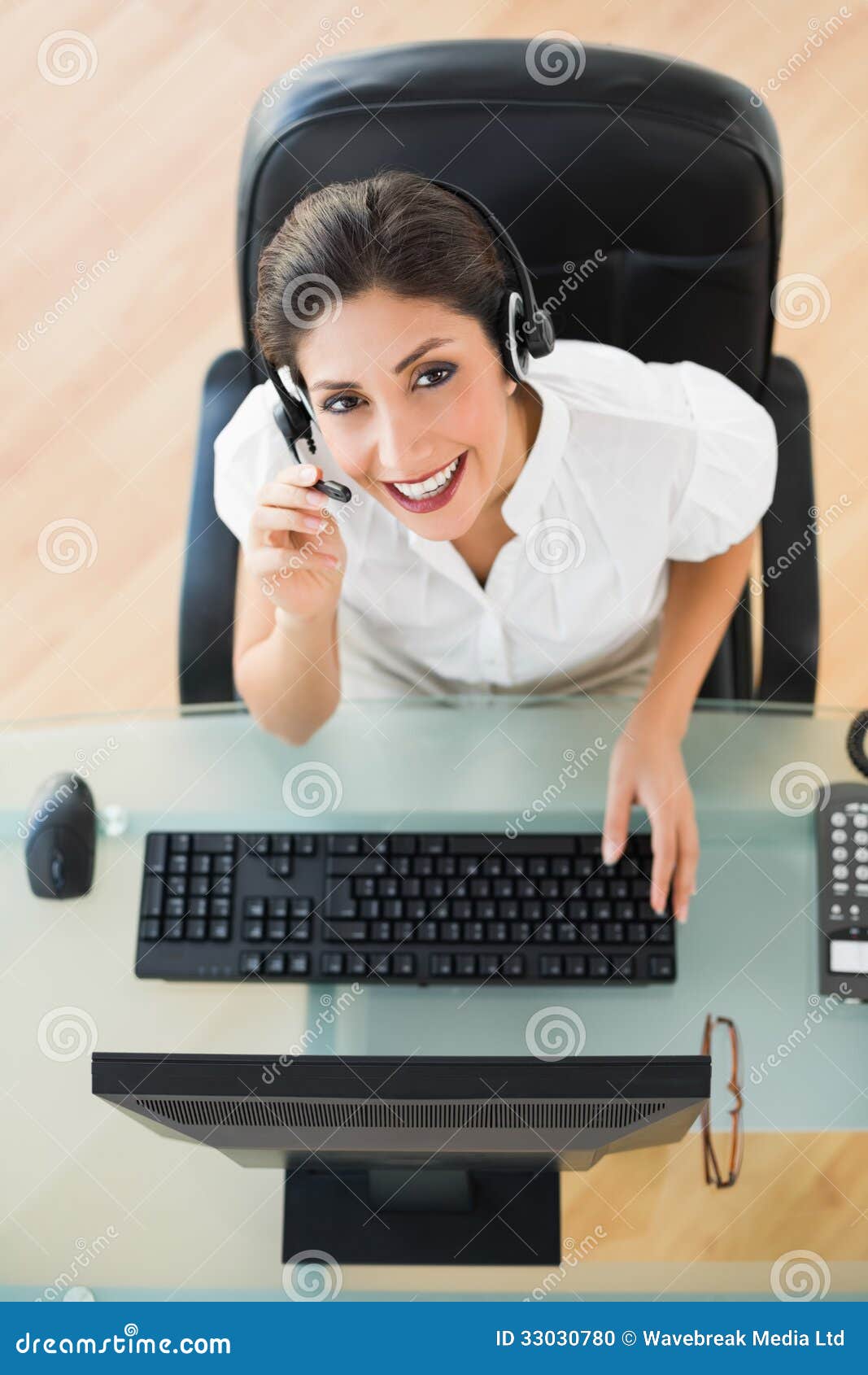 Cheerful Call Center Agent Looking at Camera while on a Call Stock ...