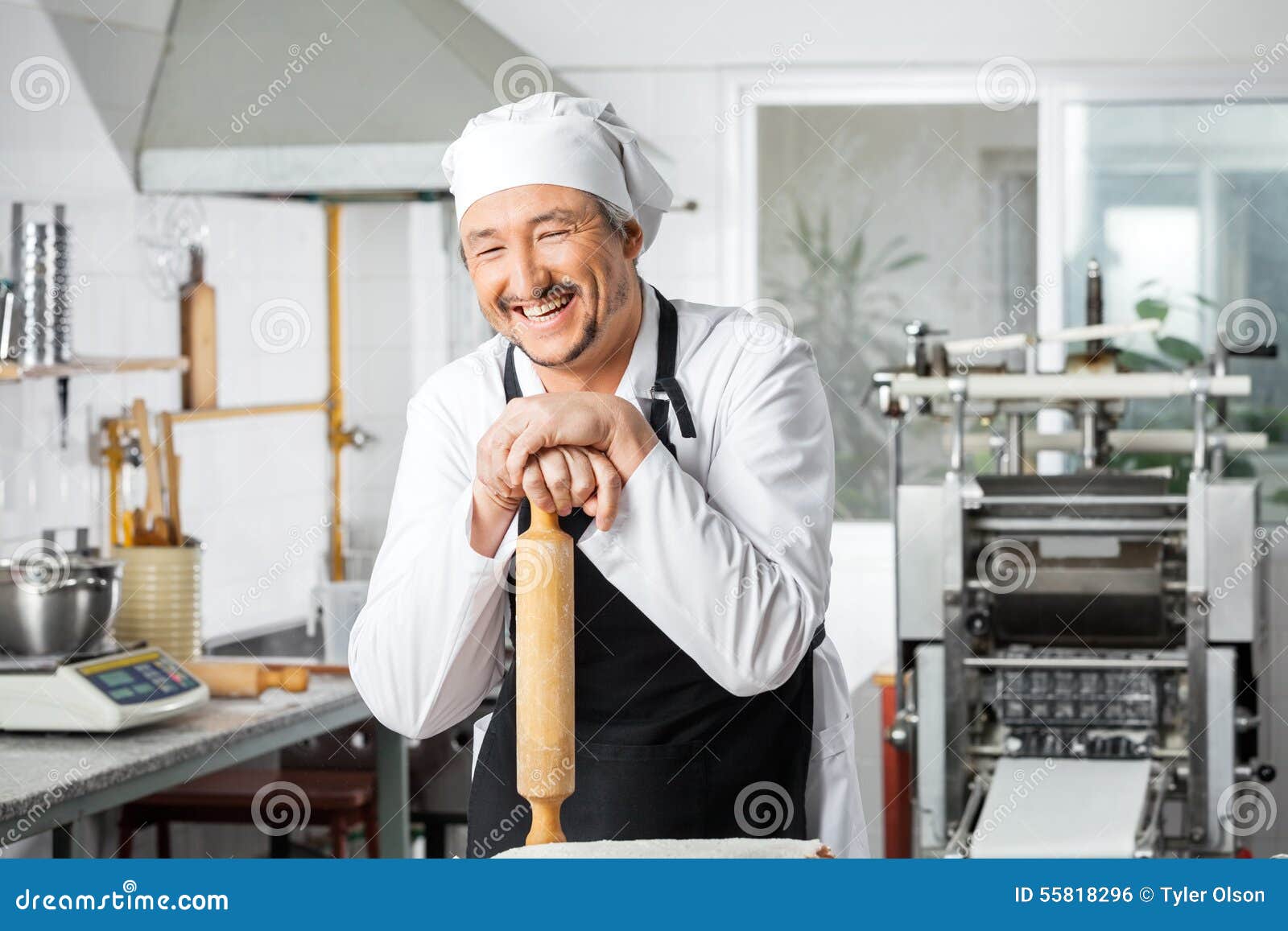 Cheerful Chef Leaning on Rolling Pin Stock Photo - Image of occupation ...