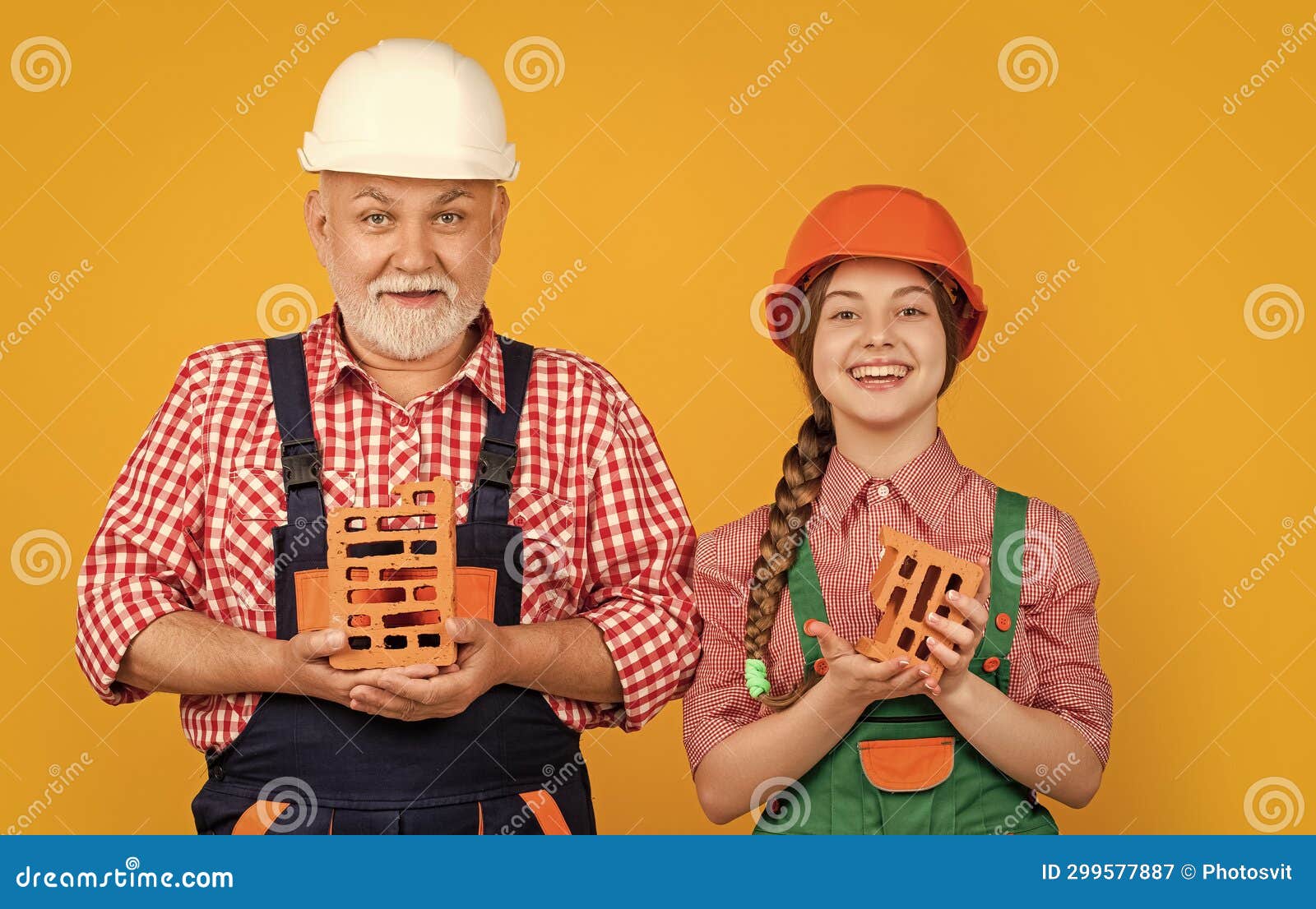 Cheerful Child and Grandfather Bricklayer in Hard Hat on Yellow ...