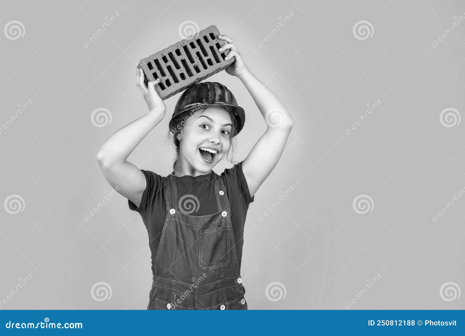 Cheerful Child Laborer Using Building Uniform and Brick, Building Stock ...