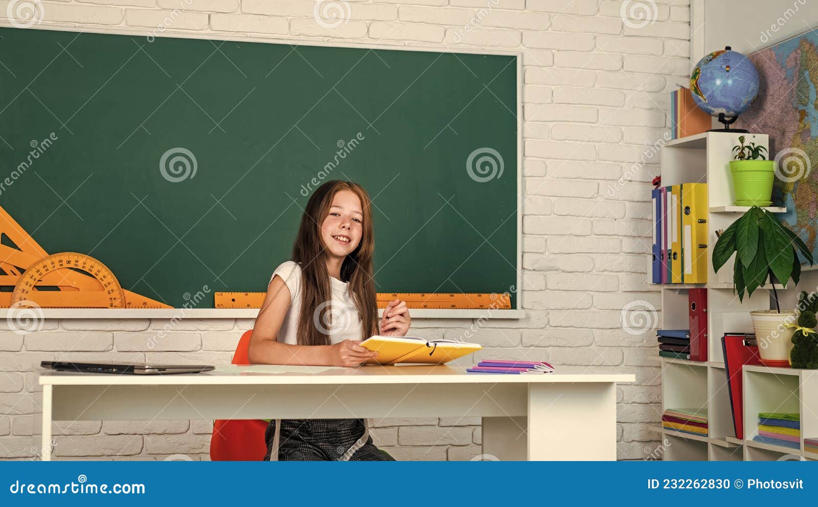 Cheerful Child Work in School Classroom during Modern Education ...