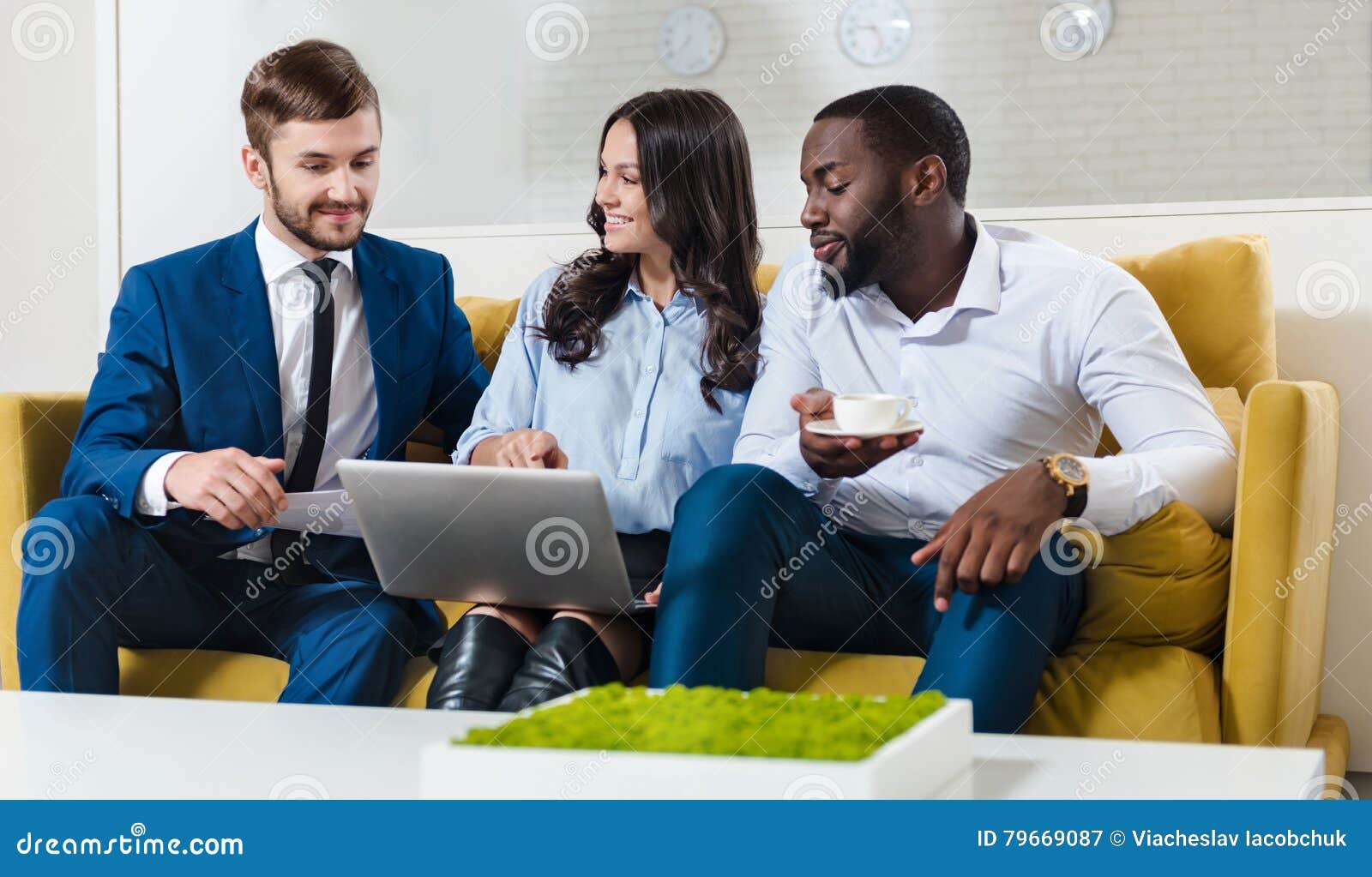 Cheerful Colleagues Sitting on the Couch Together Stock Image - Image ...