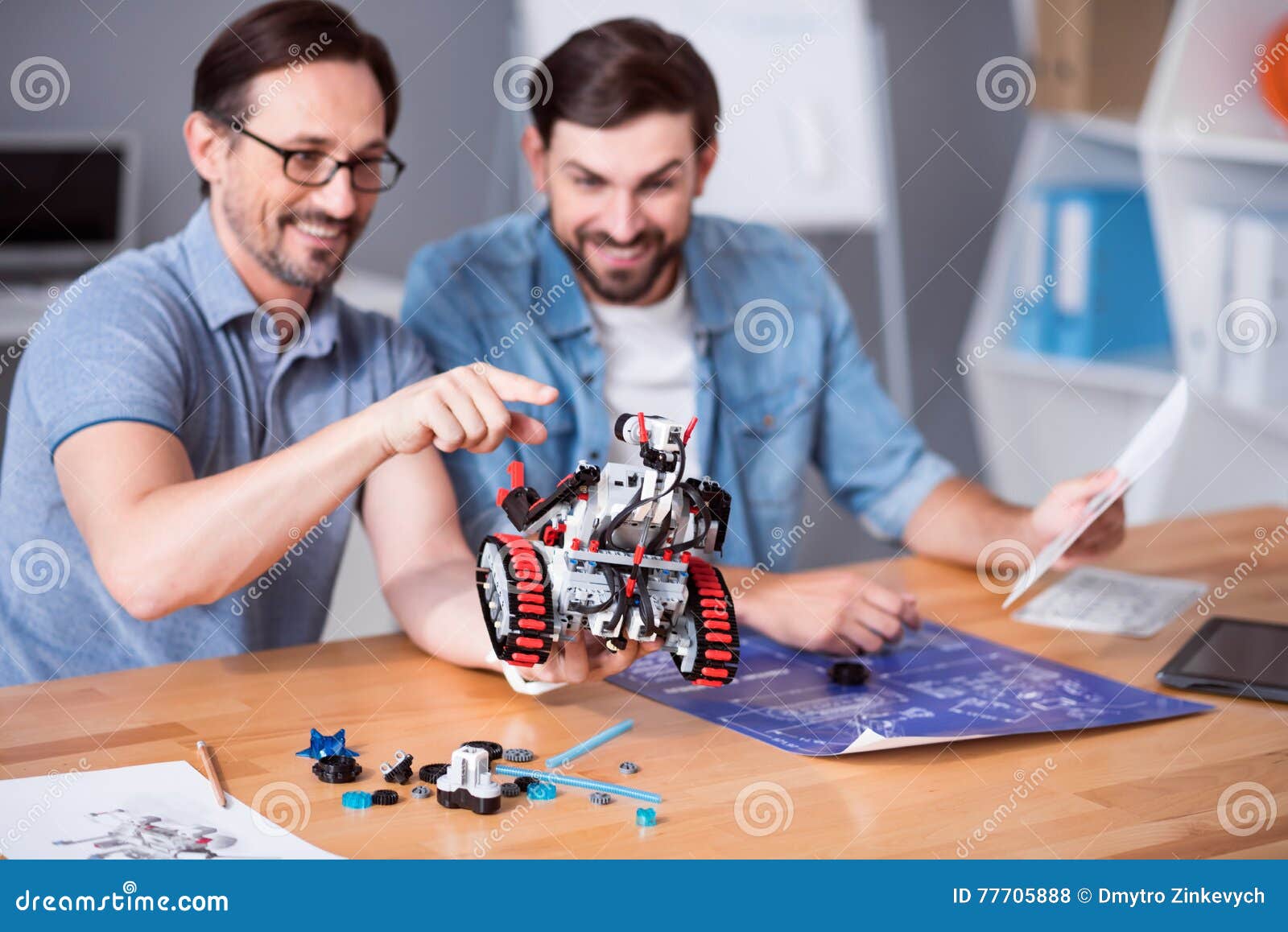 Cheerful Colleagues Using Robot Stock Photo - Image of digital ...