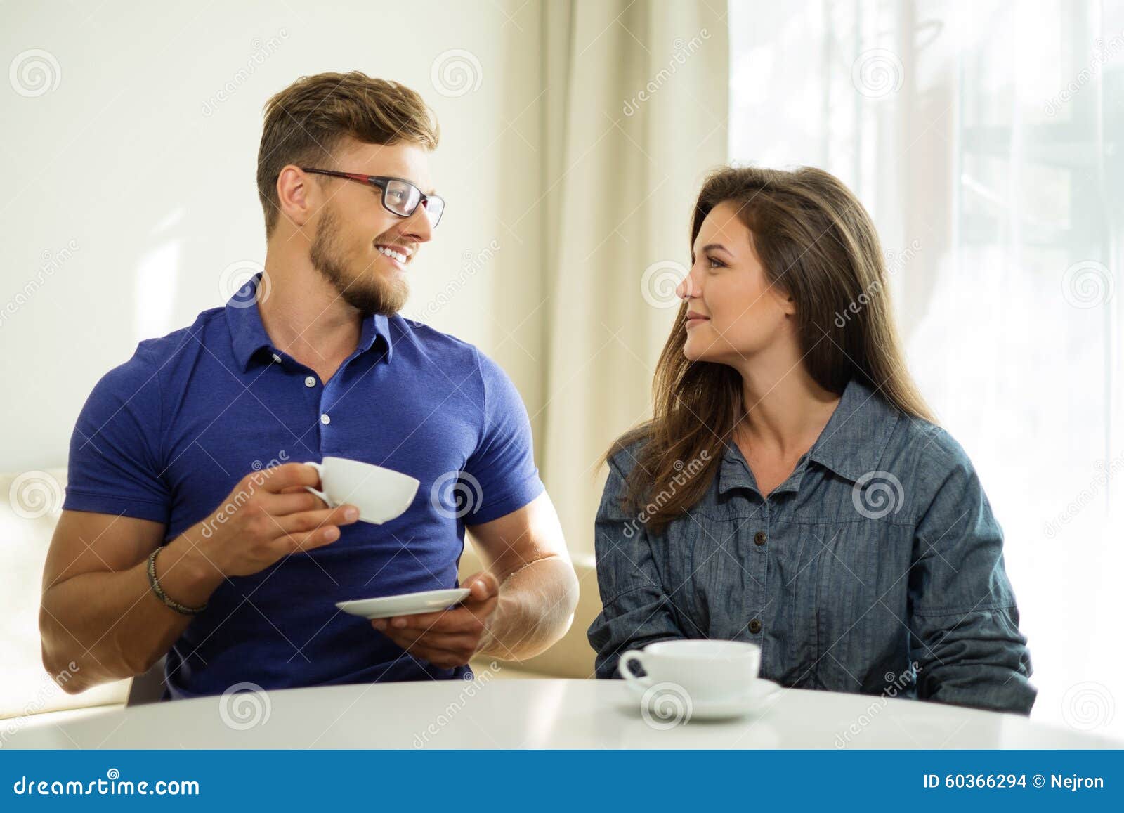 Cheerful Couple Behind Table Stock Photo - Image of people, friends ...