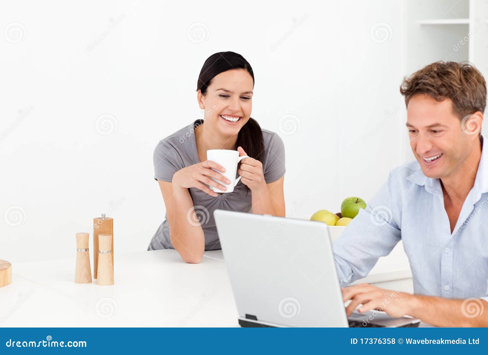 Cheerful Couple Looking at Something on Internet Stock Photo - Image of ...