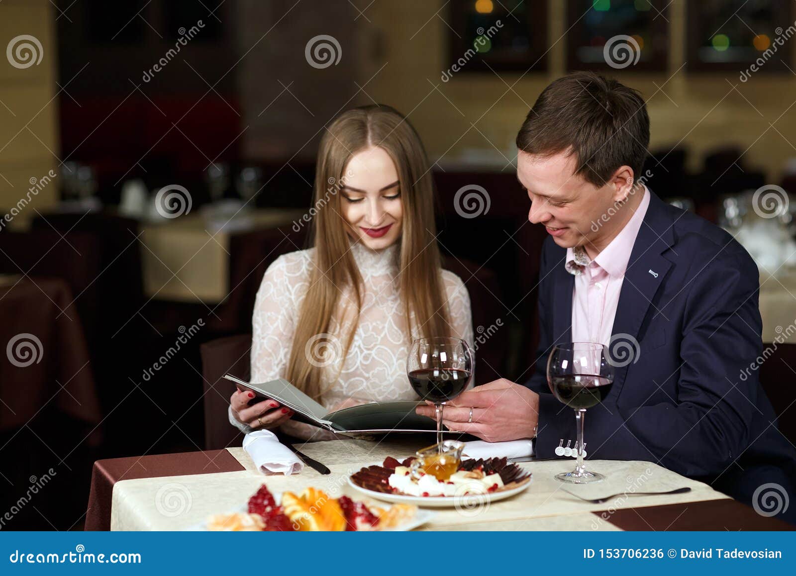 Cheerful Couple with Menu in a Restaurant. Stock Photo - Image of fruit ...