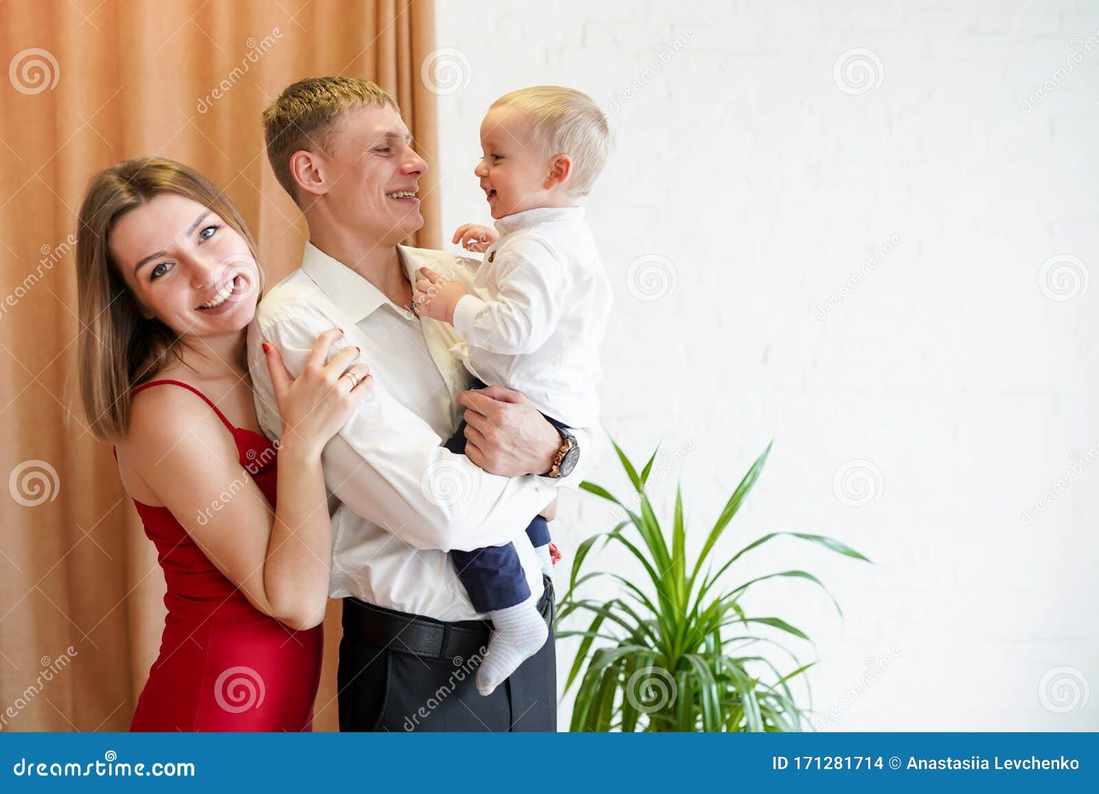 Cheerful Couple Playing with Baby Boy Stock Photo - Image of life ... Cheerful Couple Playing with Baby Boy Stock Photo - Image of life ...