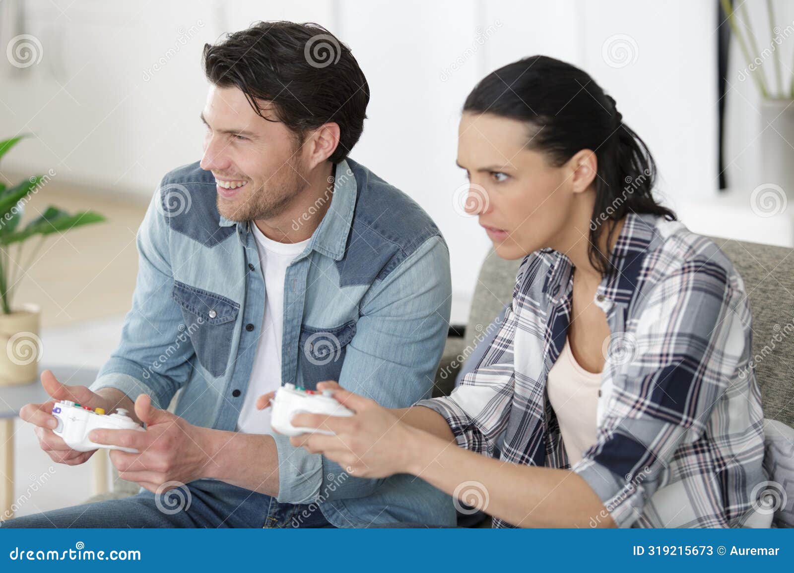 Cheerful Couple Playing Video Games at Home Stock Image - Image of ...