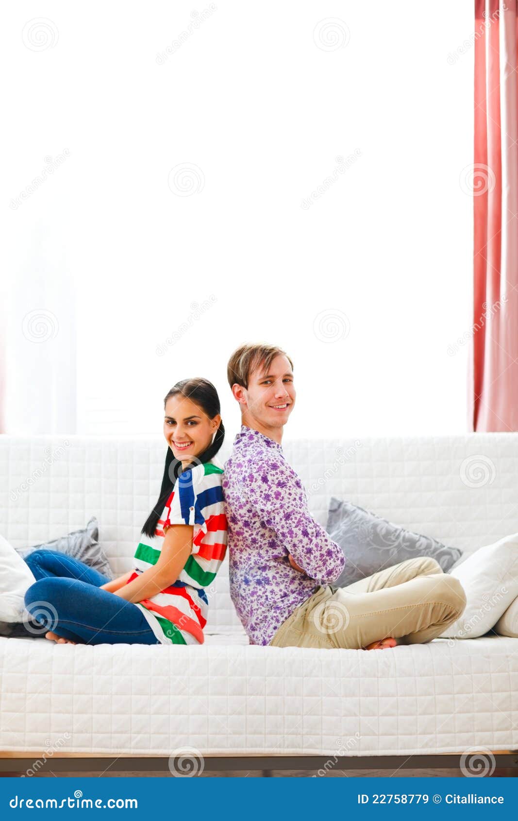 Cheerful Couple Sitting on Sofa Back To Back Stock Image - Image of ...