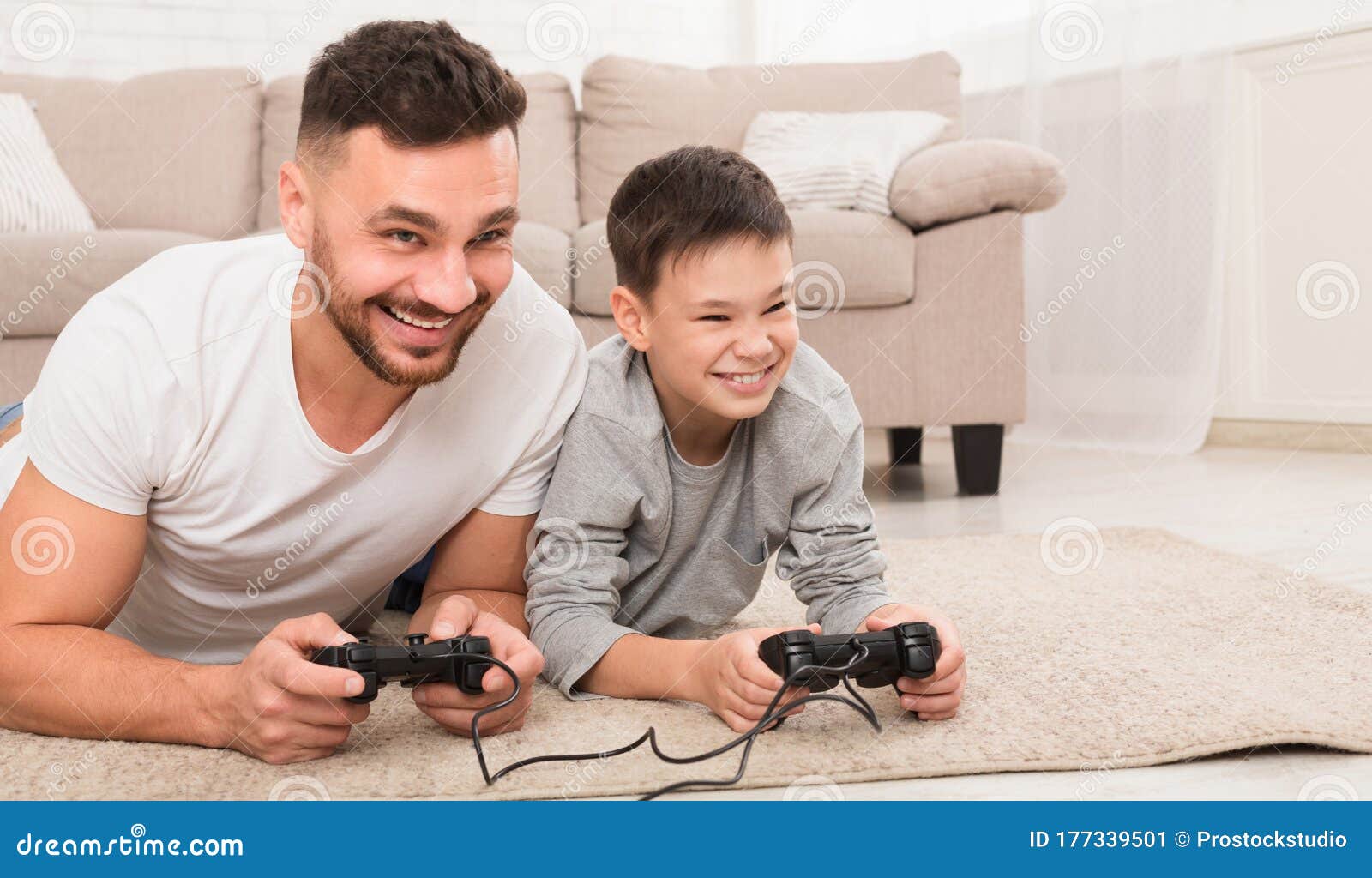 Cheerful Dad and Son Playing Video Games at Home Stock Image - Image of ...