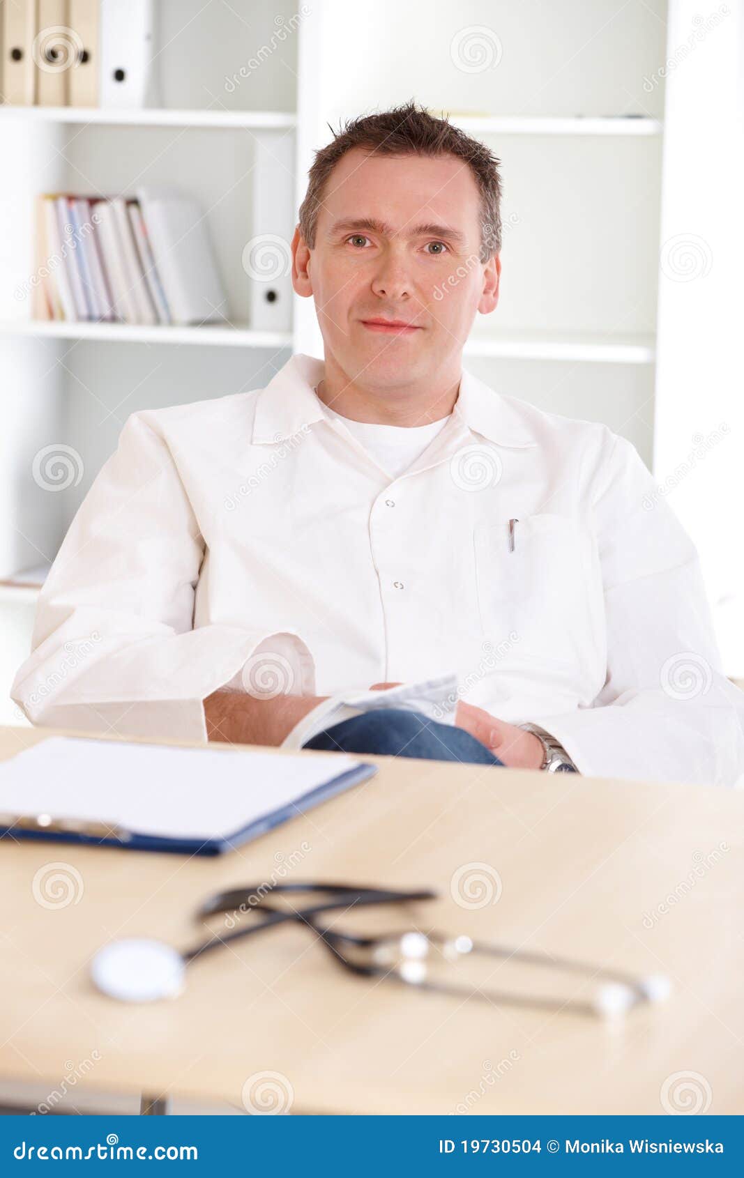 Cheerful Doctor Sitting in Office Stock Photo - Image of patient ...