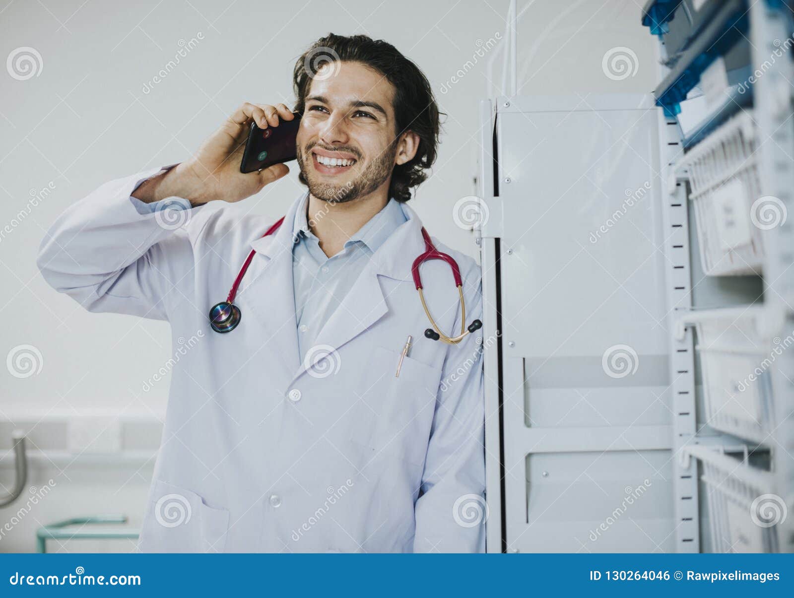 Cheerful Doctor Using a Smartphone Stock Photo - Image of medical ...