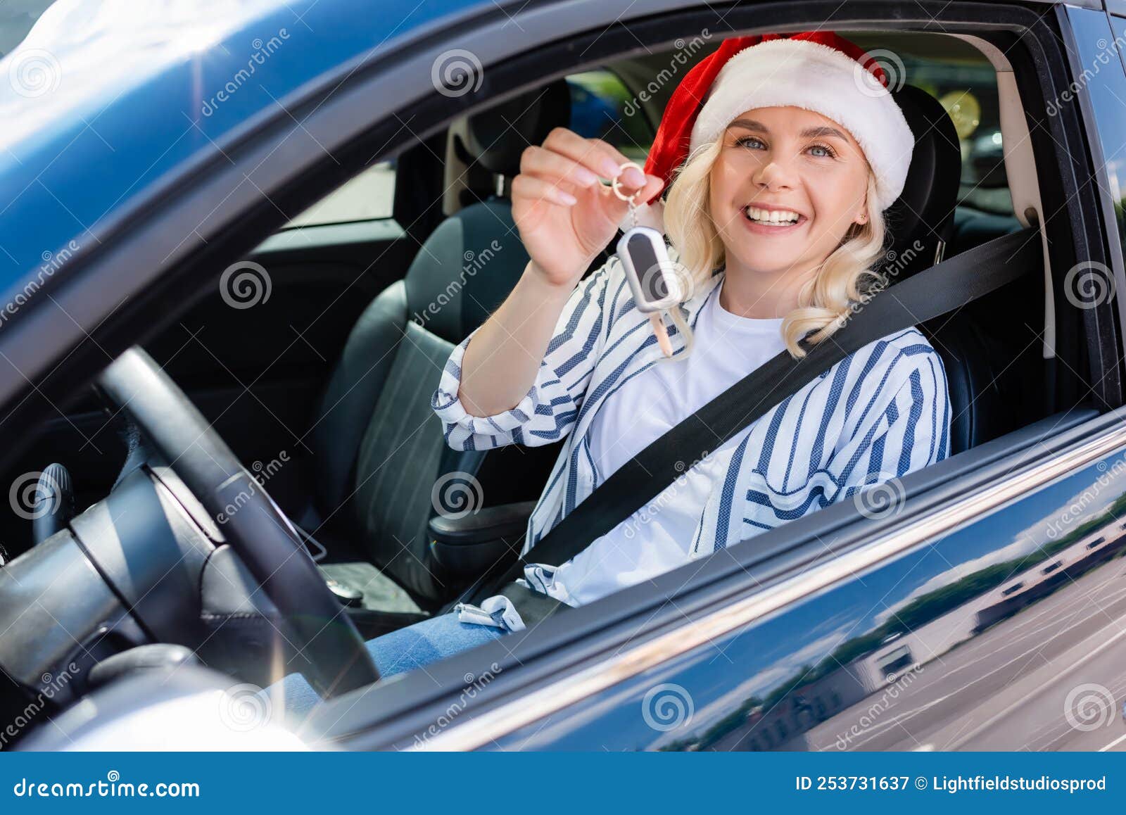 Cheerful Driver in Santa Hat Holding Stock Image - Image of woman ...