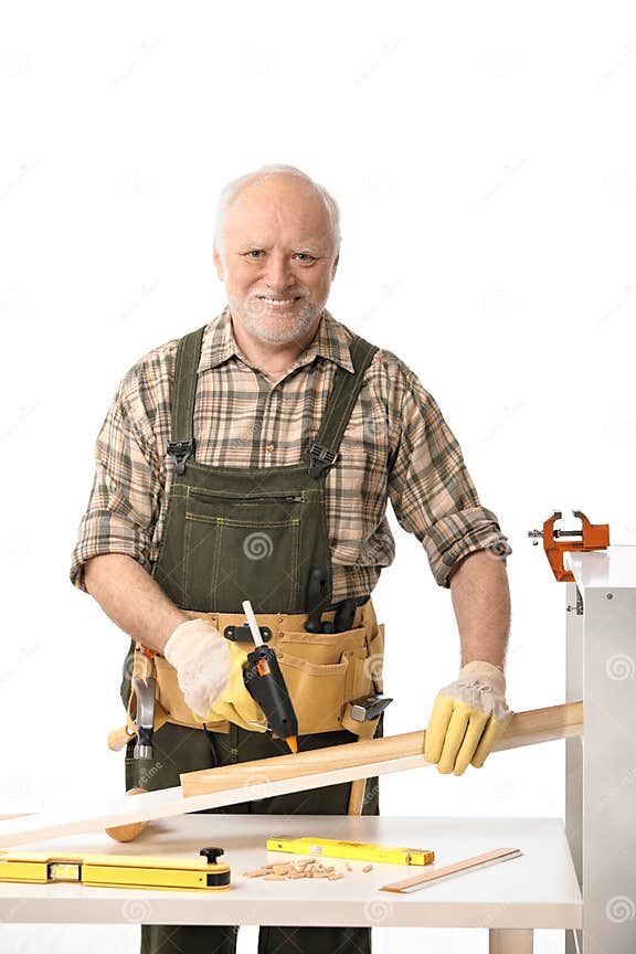 Cheerful Elderly Man Tinkering Stock Photo - Image of gray, foreman ...