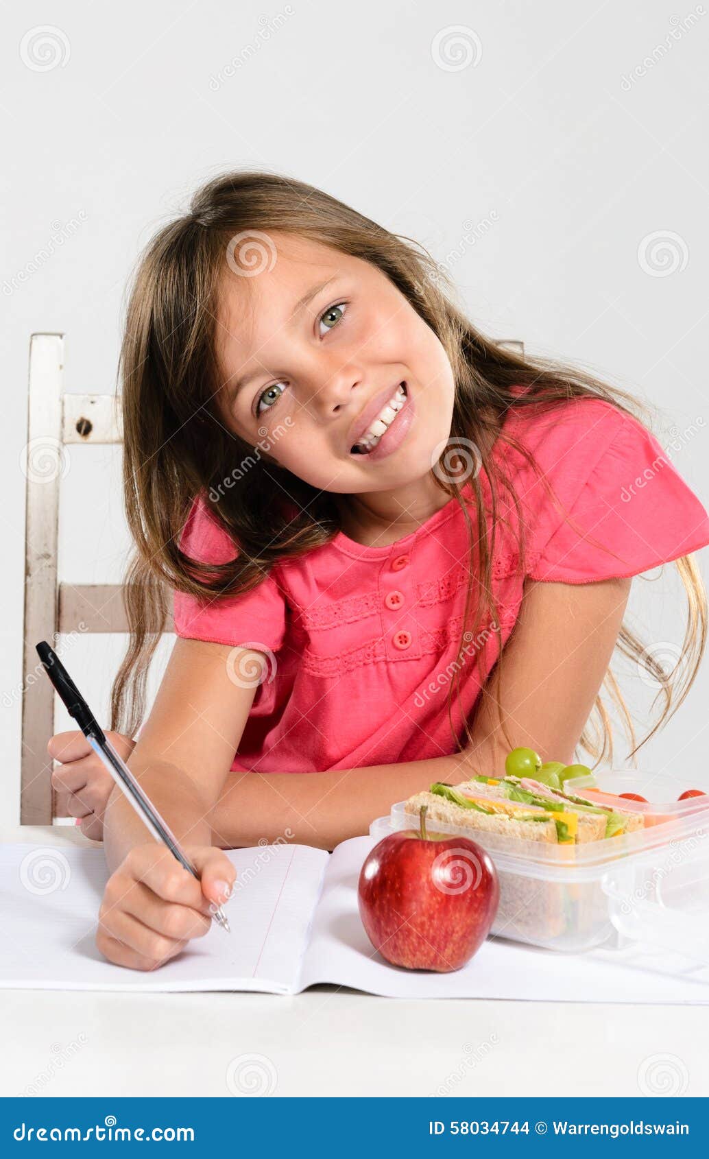 Cheerful Elementary School Girl Does Her Homework Stock Photo - Image ...