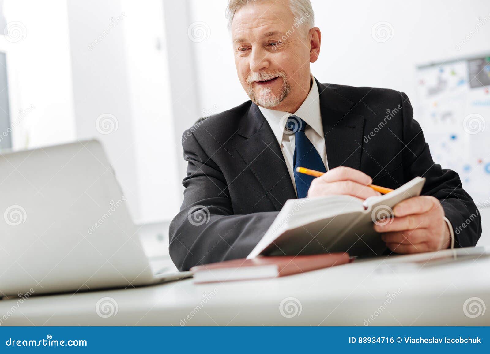 Cheerful Employer Taking Notes at the Workplace Stock Photo - Image of ...