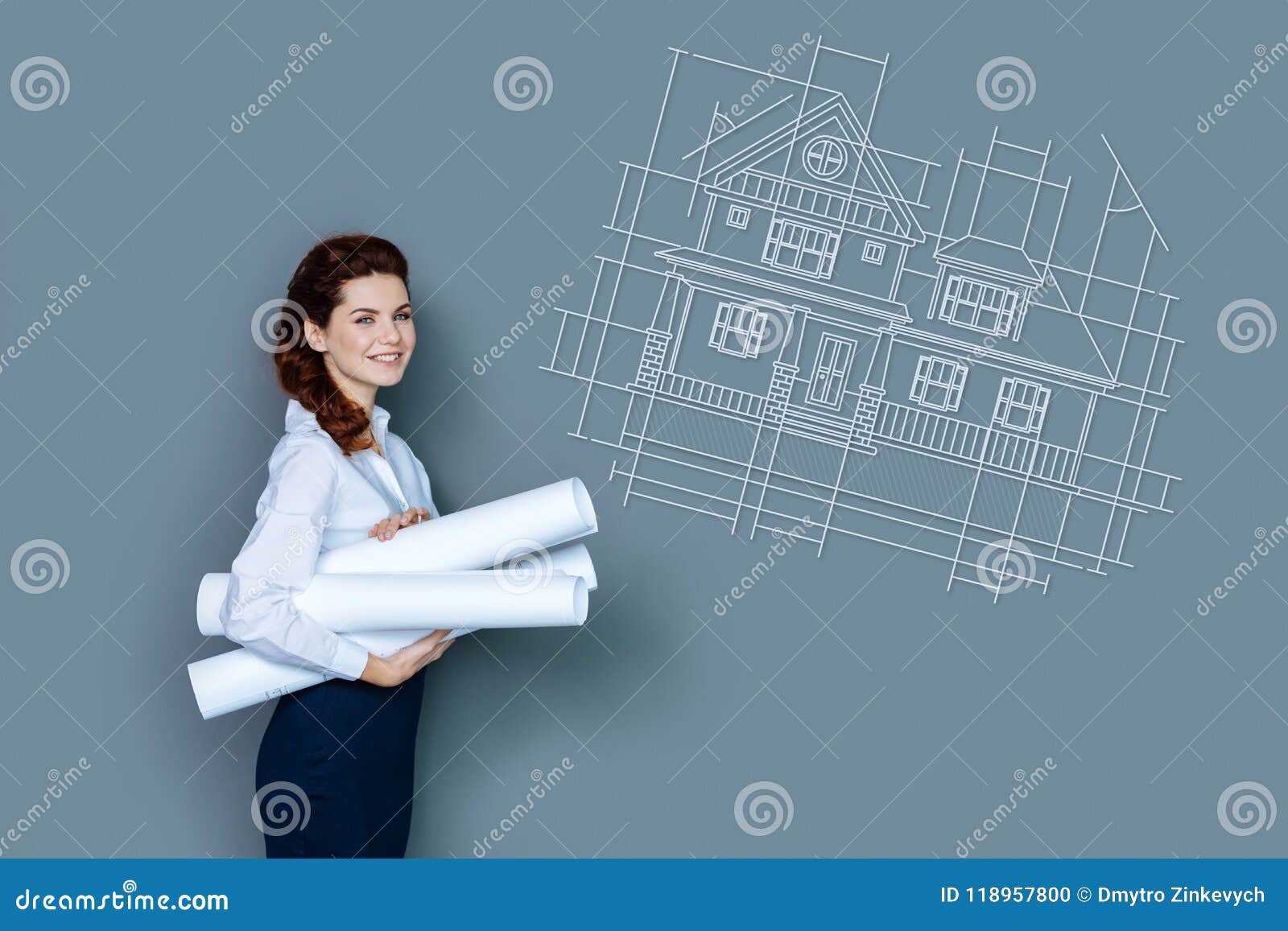 Cheerful Engineer Holding Graphics and Looking Happy Stock Photo ...