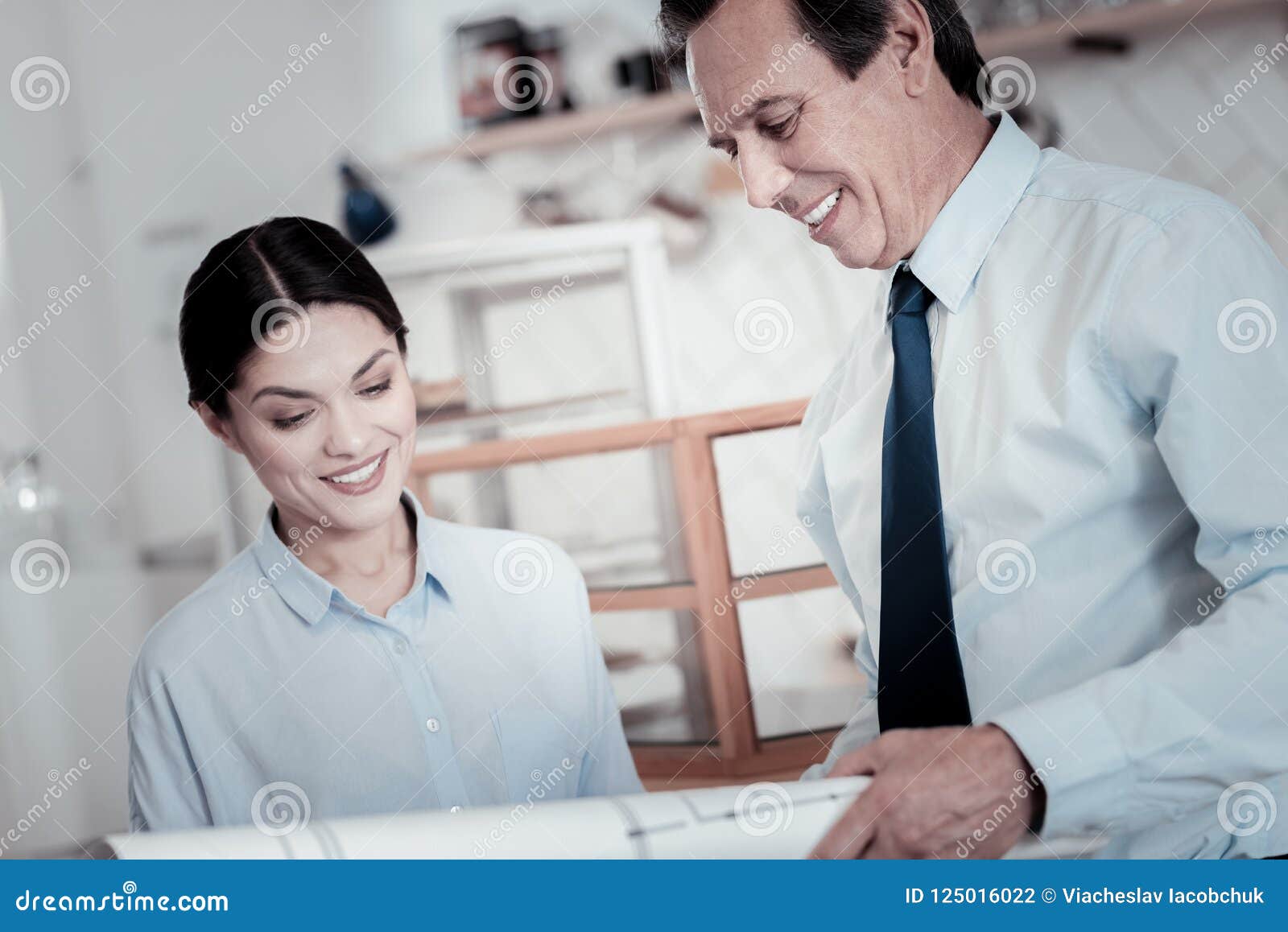 Cheerful Engineers Looking at the Scheme and Smiling Happily Stock ...