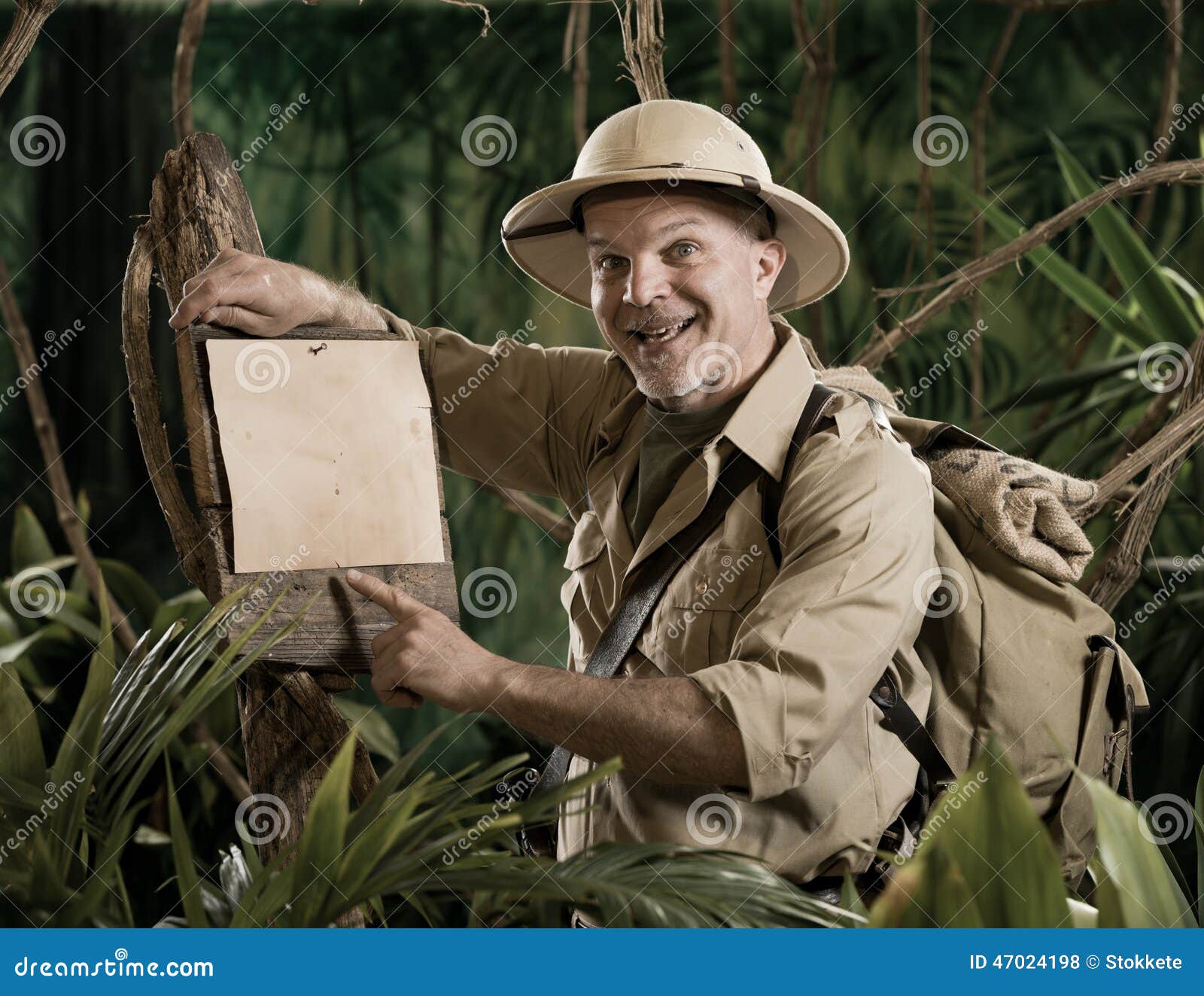 Cheerful Explorer Pointing To a Sign Stock Photo - Image of positivity ...