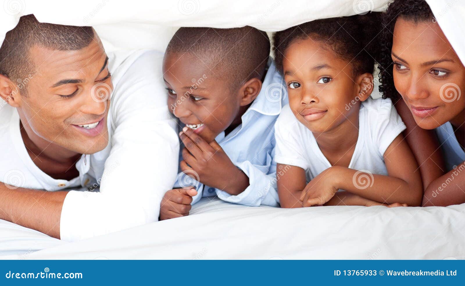 Cheerful Family Having Fun Lying Down on Bed Stock Image - Image of ...