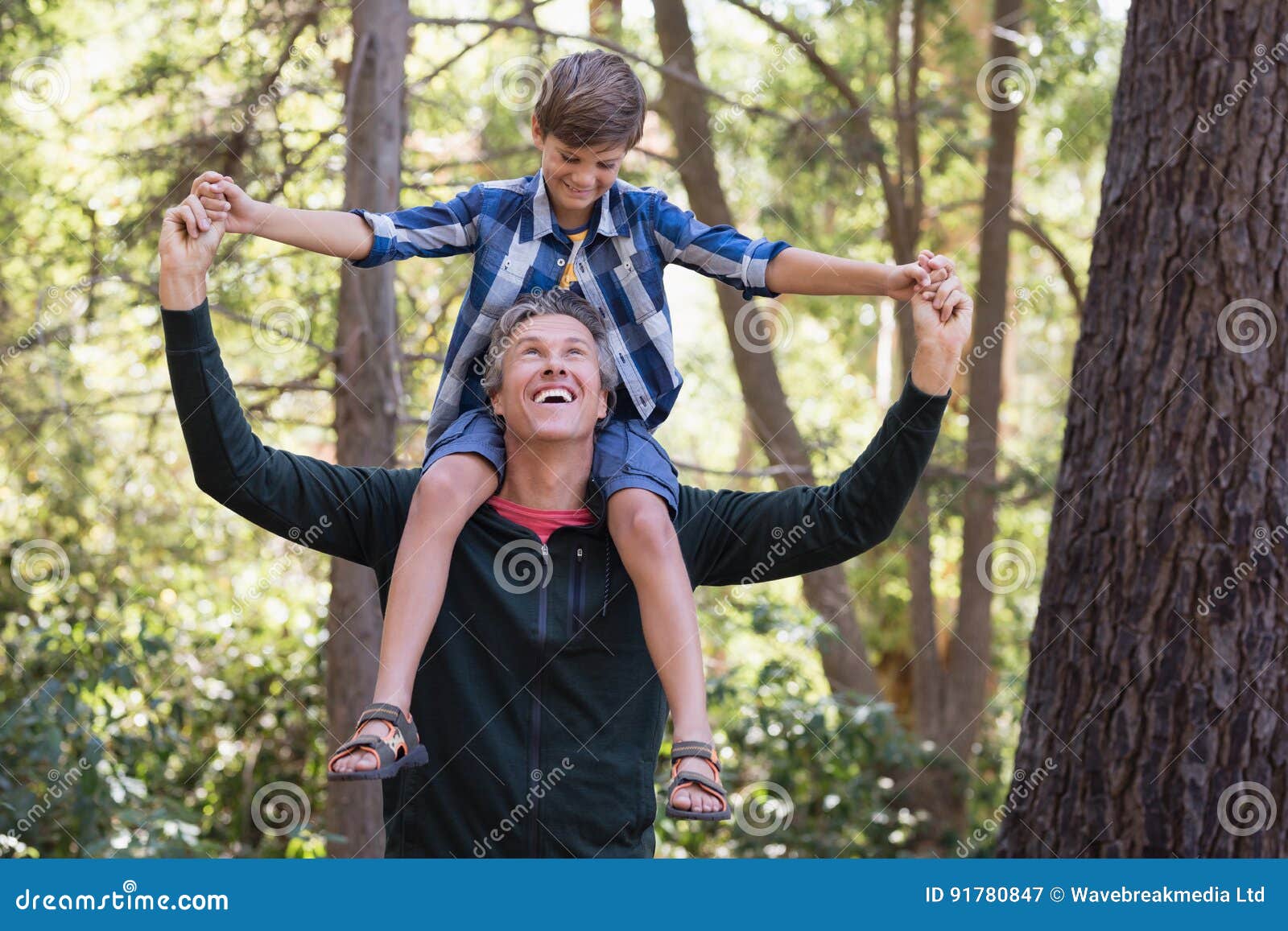 Cheerful Father Carrying Son on Shoulders in Forest Stock Image - Image ...