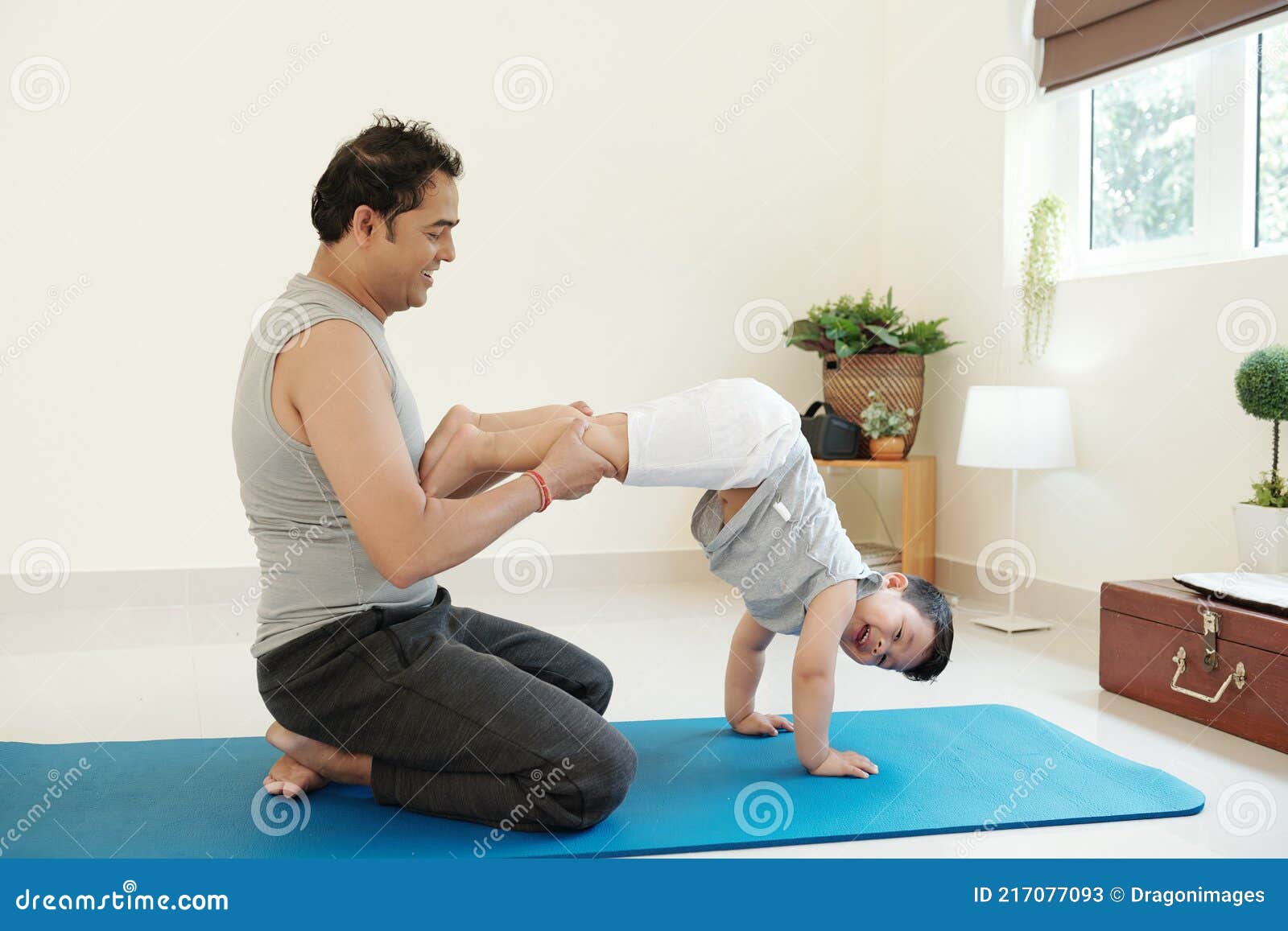 Father Helping Son with Handstand Stock Image - Image of balance, male ...