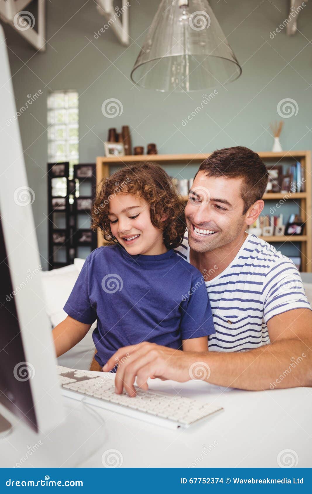 Cheerful Father and Son Using Computer at Home Stock Photo - Image of ...