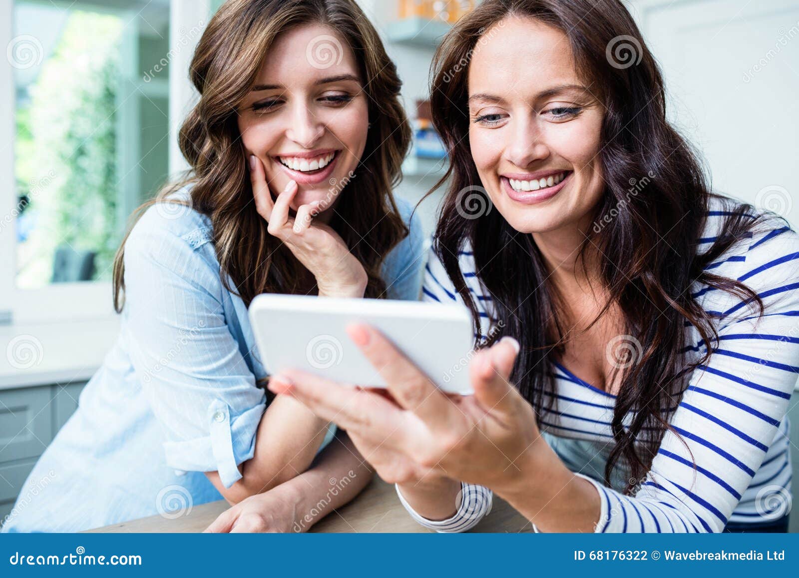 Cheerful Female Friends Using Mobile Phone Stock Photo - Image of front ... Cheerful Female Friends Using Mobile Phone Stock Photo - Image of front ...