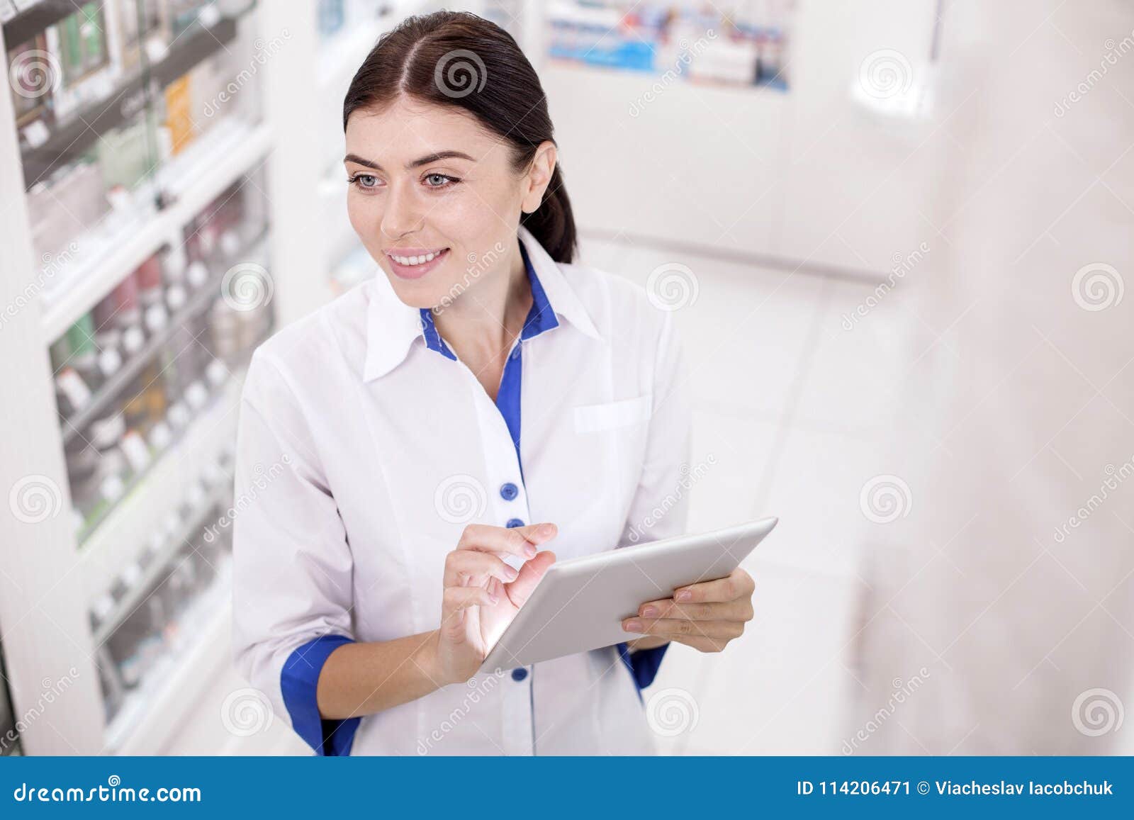 Cheerful Female Pharmacist Working with Tablet Stock Image - Image of ...