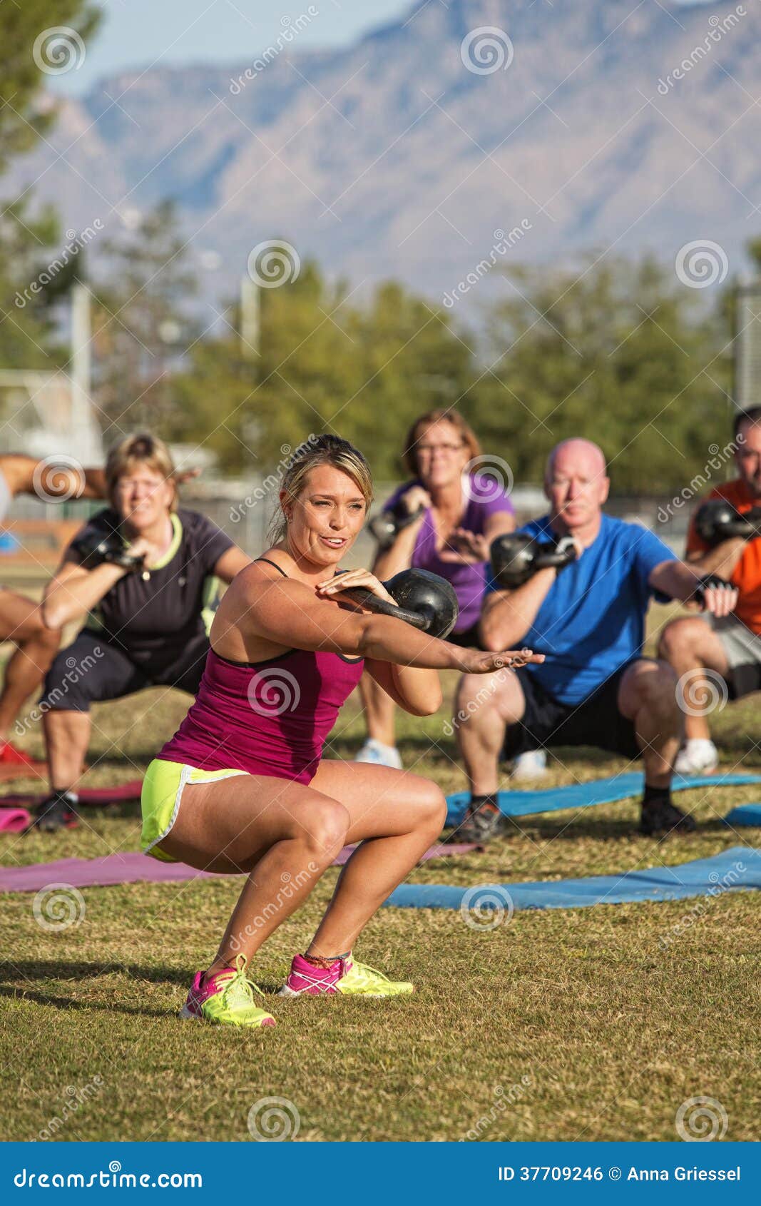 Cheerful Fitness Instructor with Class Stock Photo - Image of fitness ...