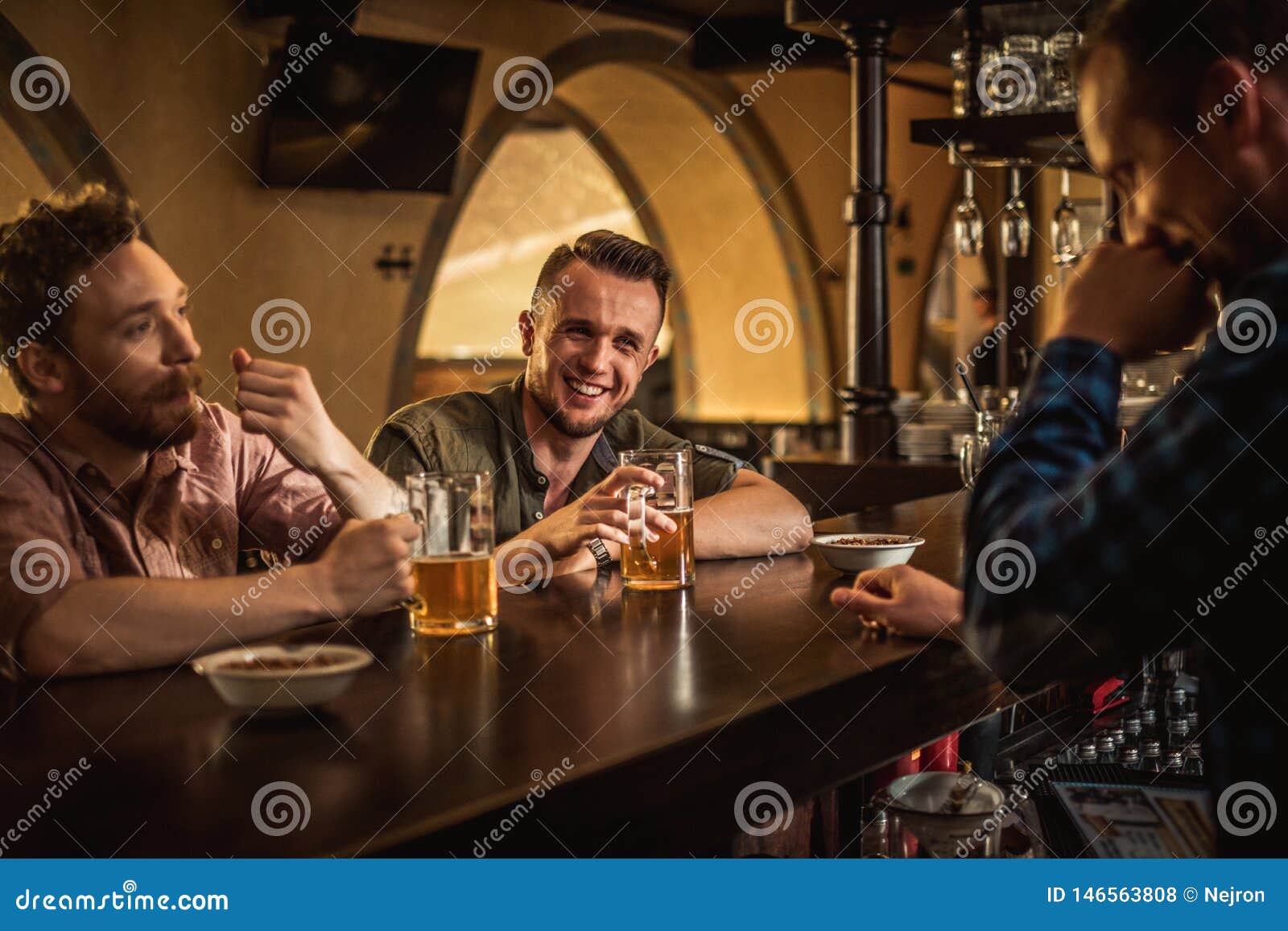 Cheerful Friends Drinking Draft Beer in a Pub Stock Photo - Image of ...