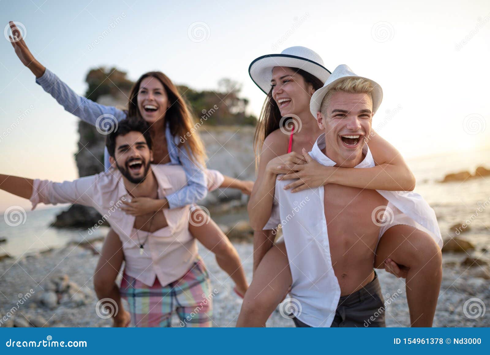 Cheerful Friends Enjoying Weekend and Having Fun on Beach Stock Photo ...