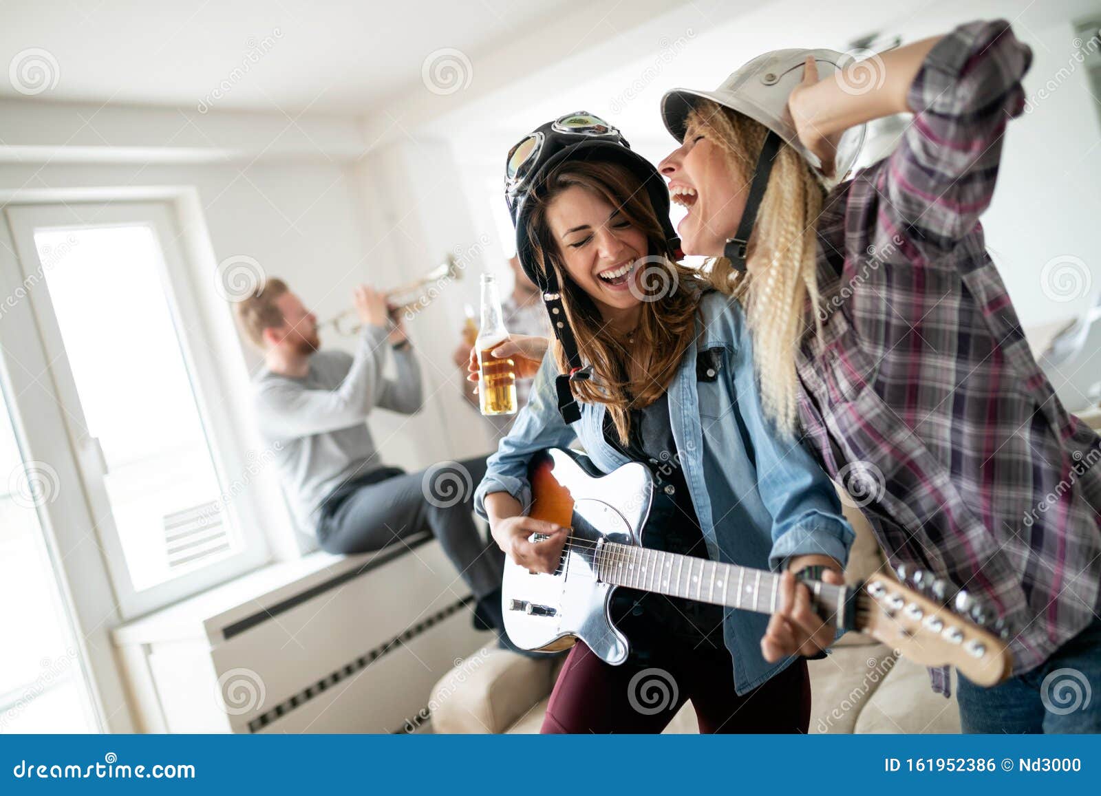 Cheerful Friends Having Party Together and Playing Instruments Stock ...
