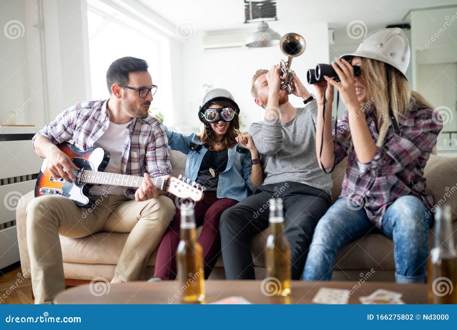 Cheerful Friends Having Party Together and Playing Instruments Stock ...
