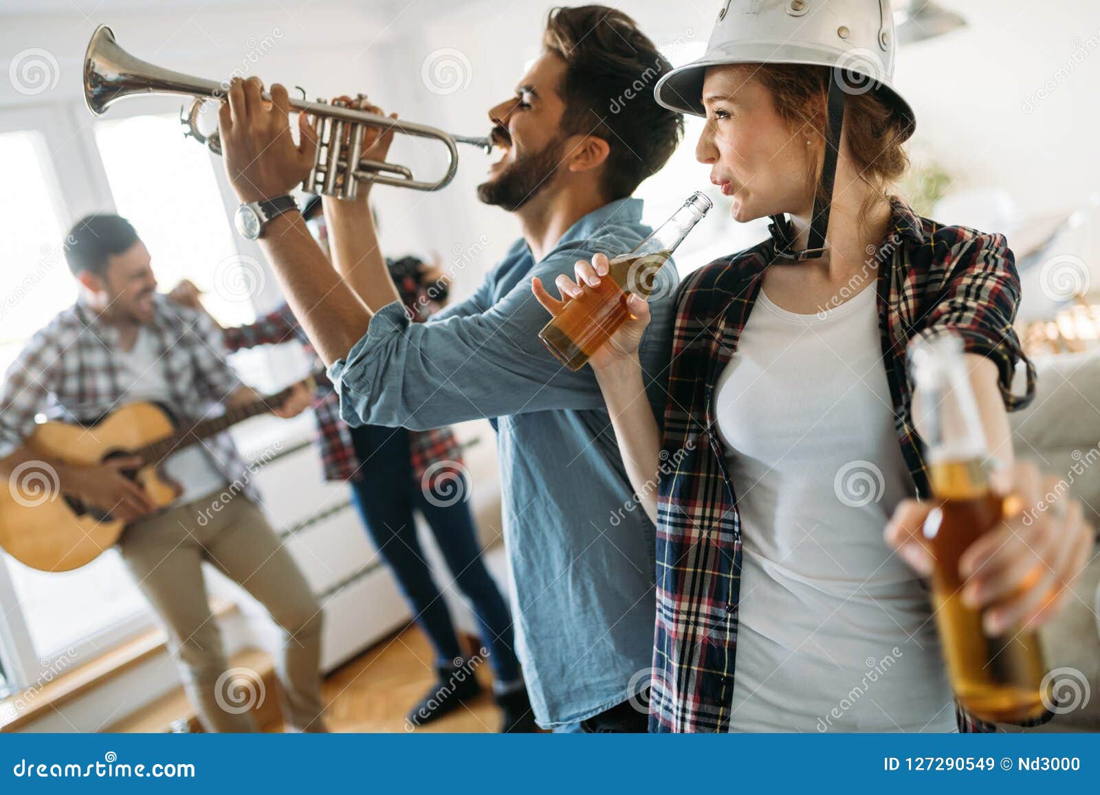 Cheerful Friends Having Party Together and Playing Instruments Stock ...