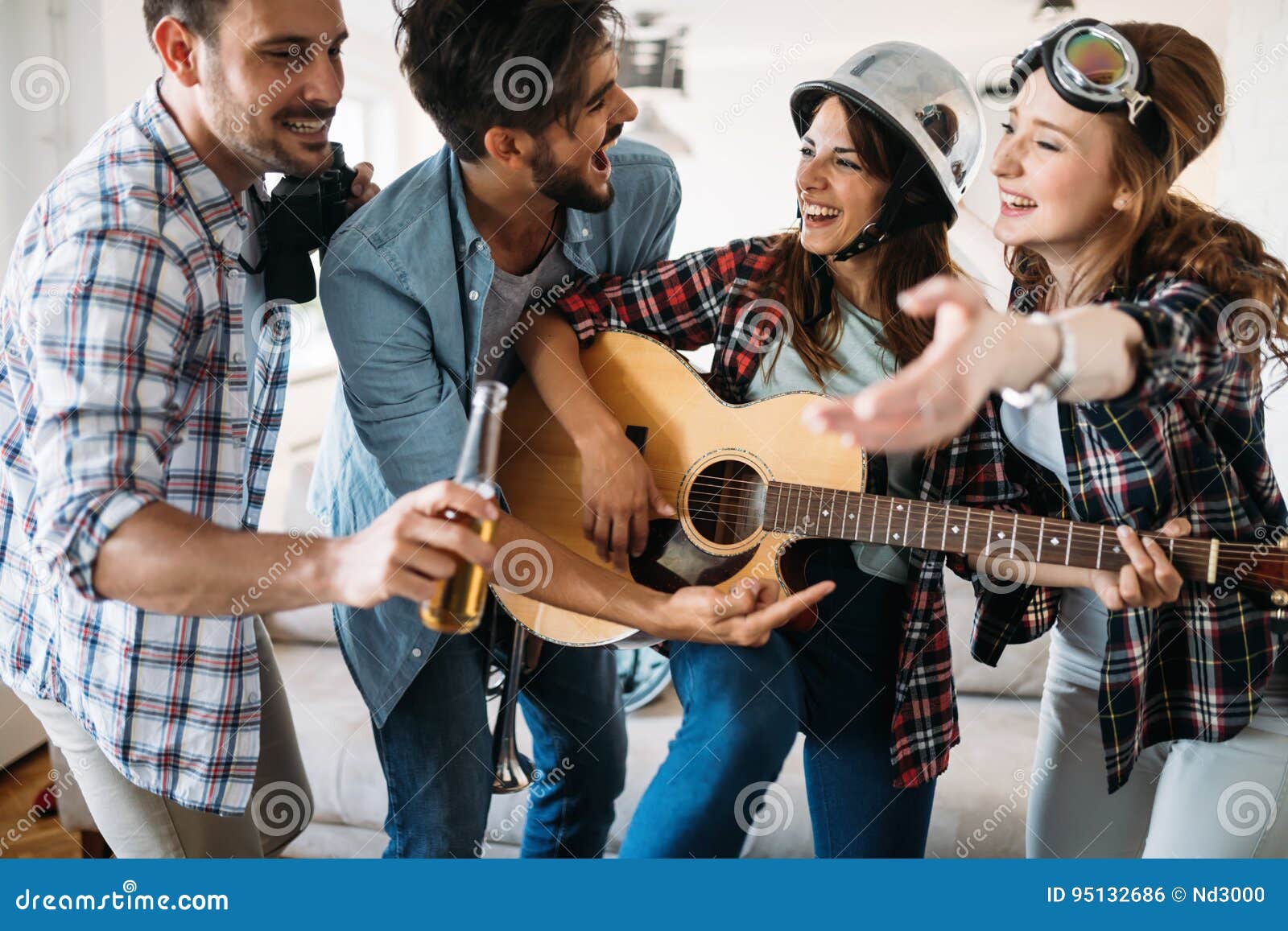 Cheerful Friends Having Party Together and Playing Instruments Stock ...