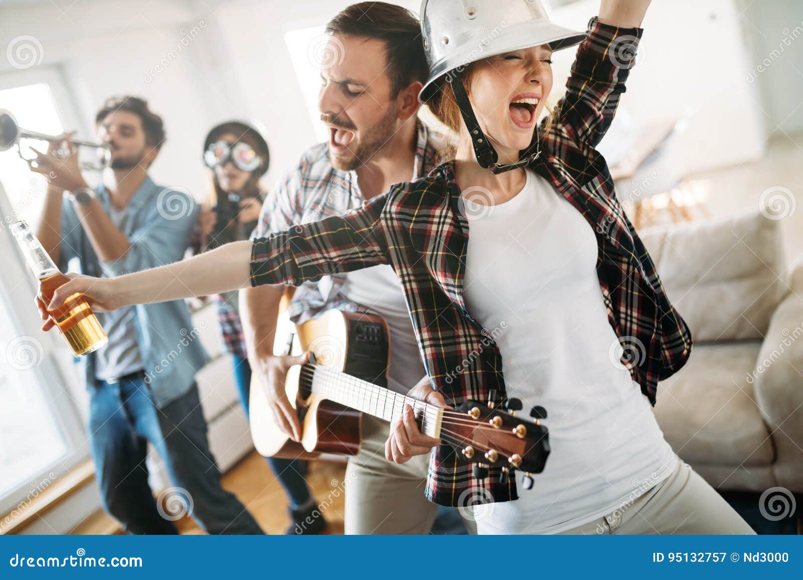 Cheerful Friends Having Party Together and Playing Instruments Stock ...