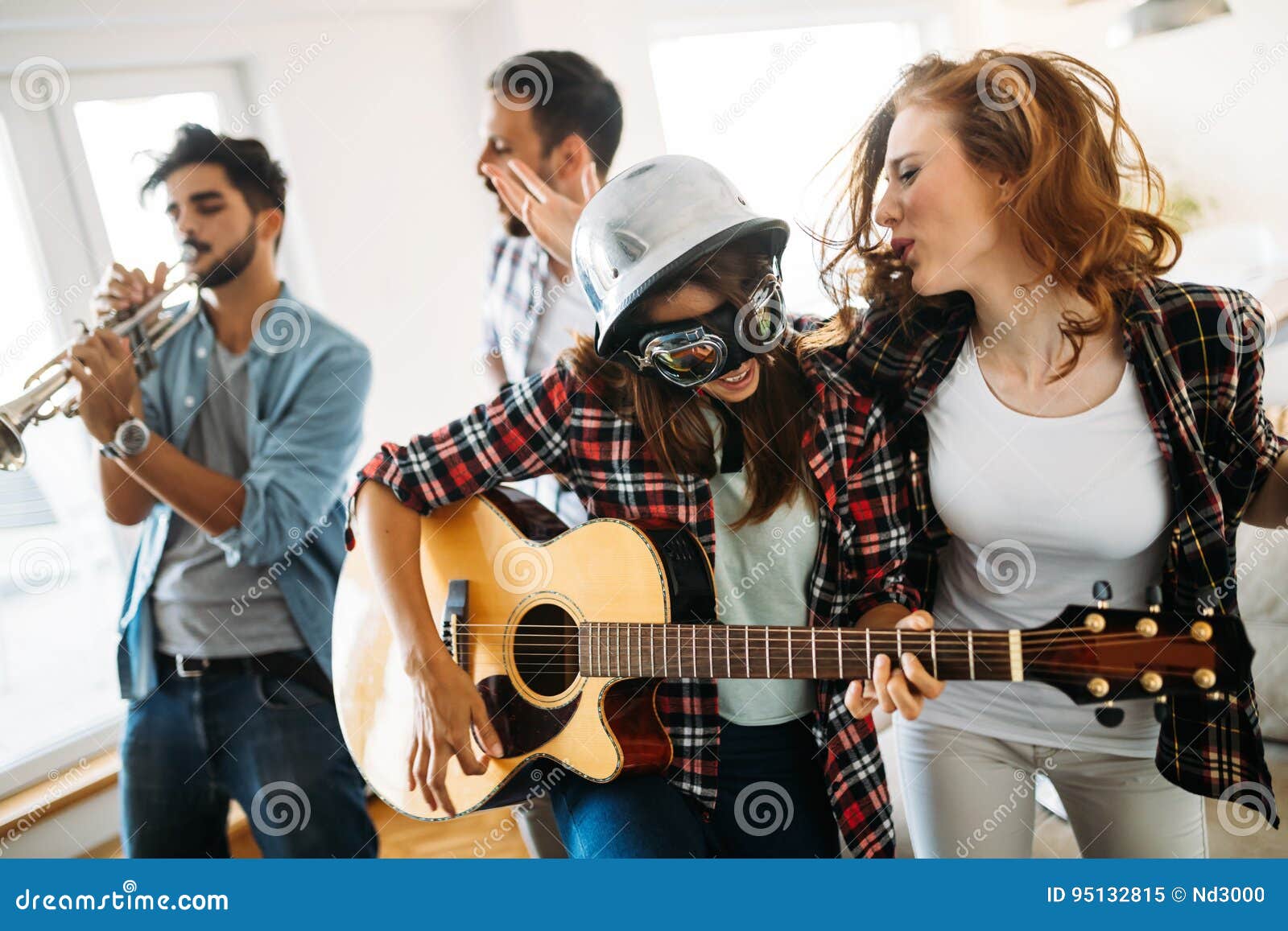 Cheerful Friends Having Party Together and Playing Instruments Stock ...